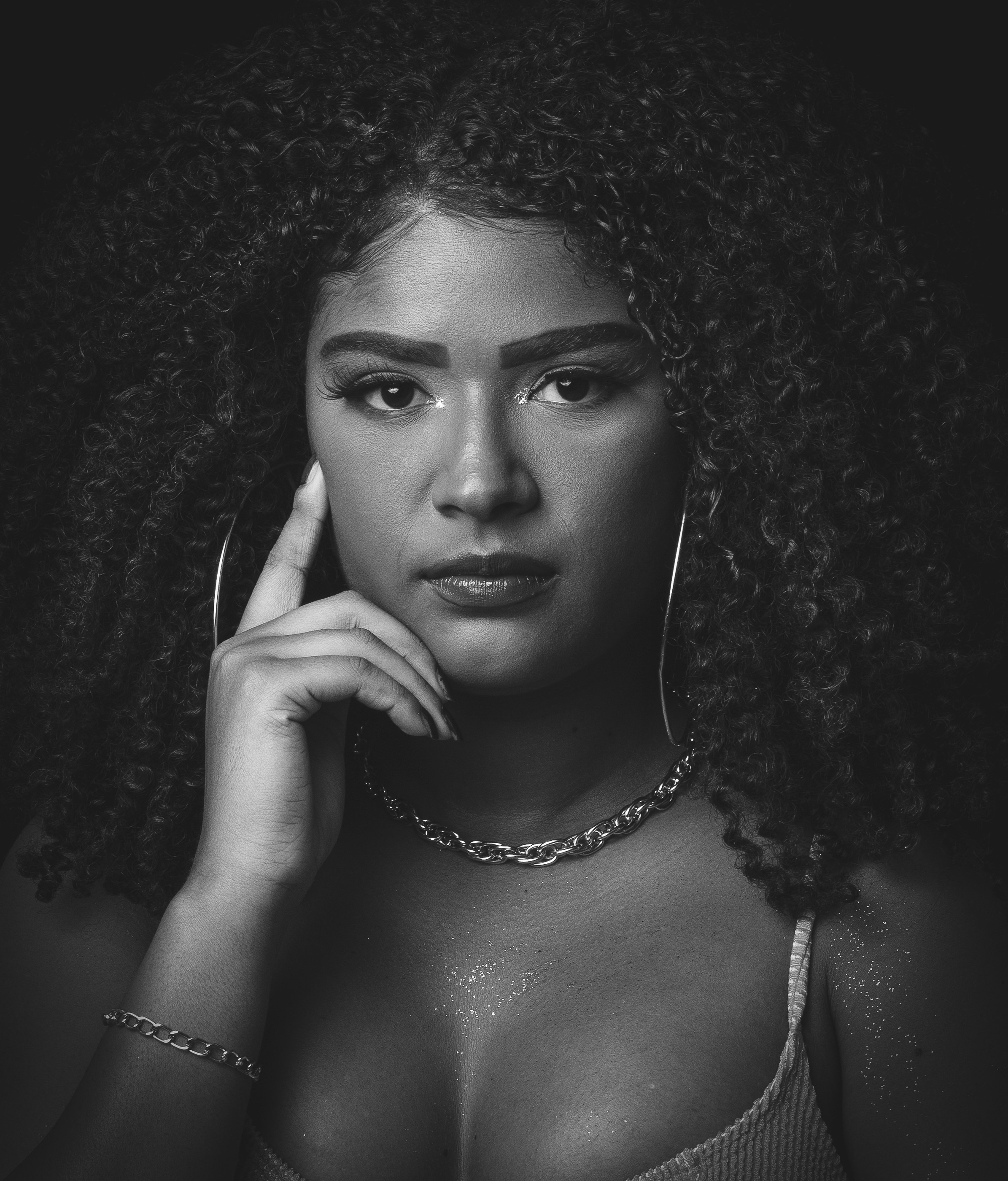 Gaze of Quiet Resolve: A Black-and-White Portrait with Curly Halo