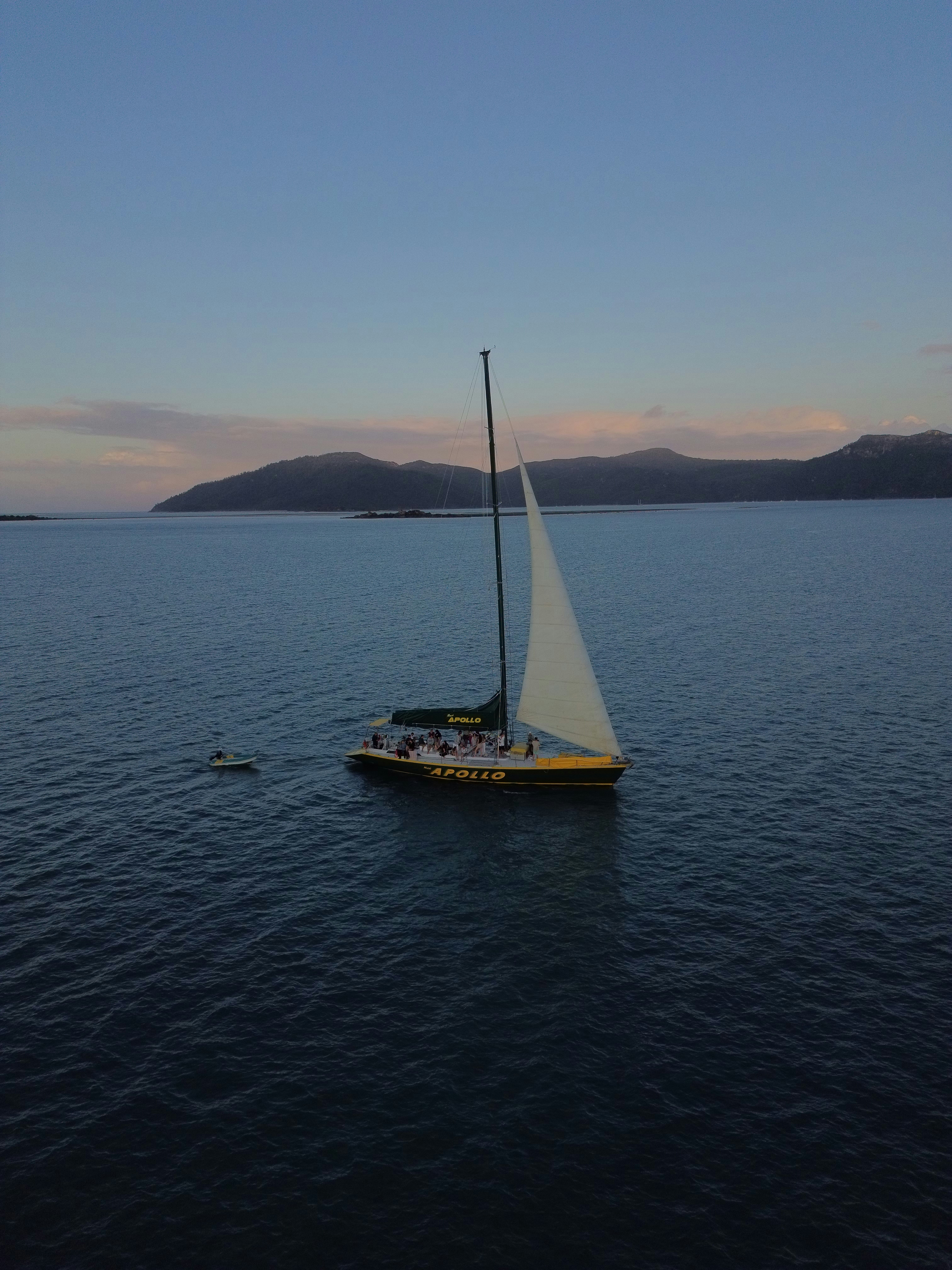 Sailboat on a Quiet Blue Expanse at Dusk