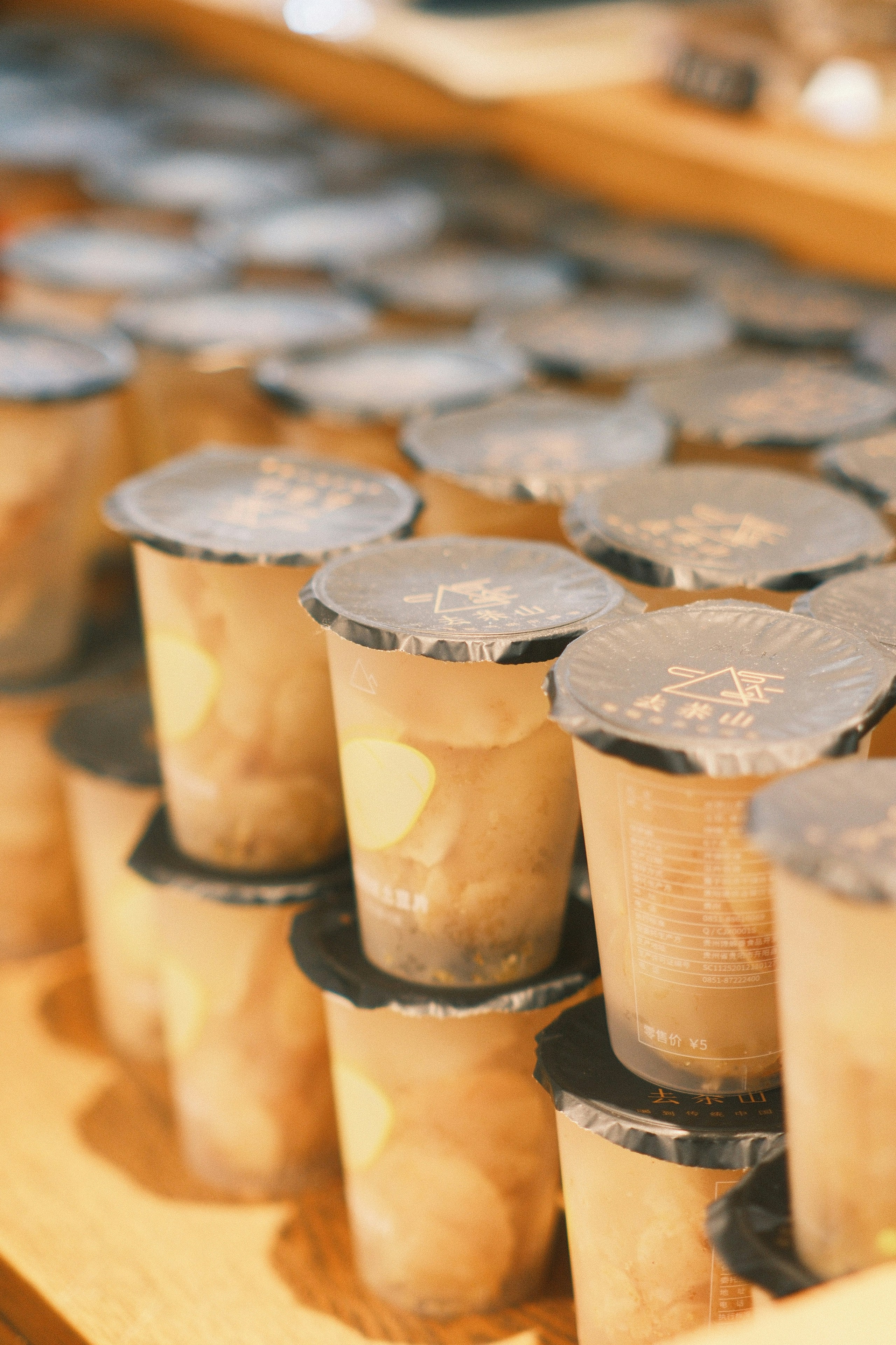 A close up of many cups of food on a table photo – Free Milk tea shop ...