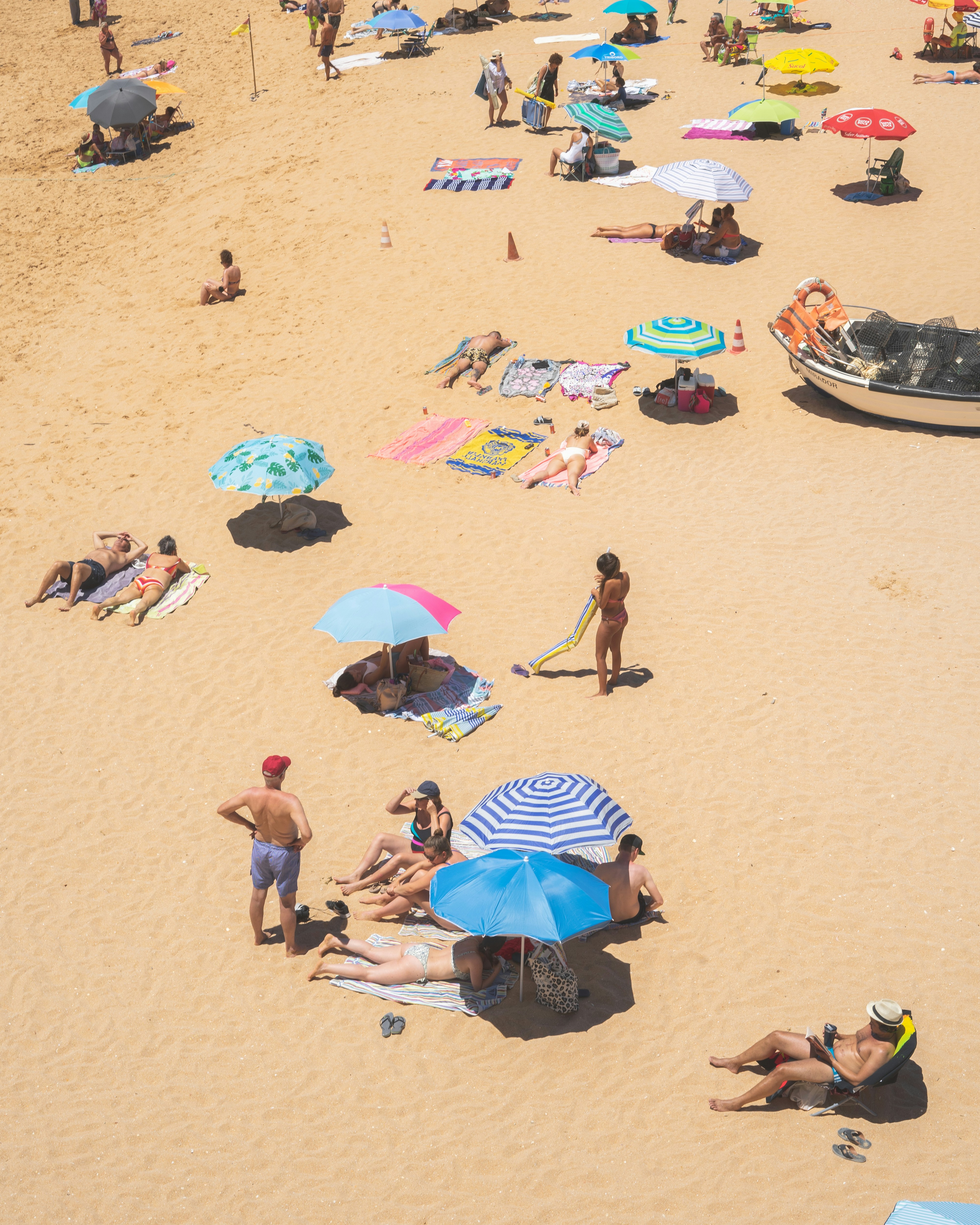 A crowded beach with many people and umbrellas photo – Free Lagos Image ...