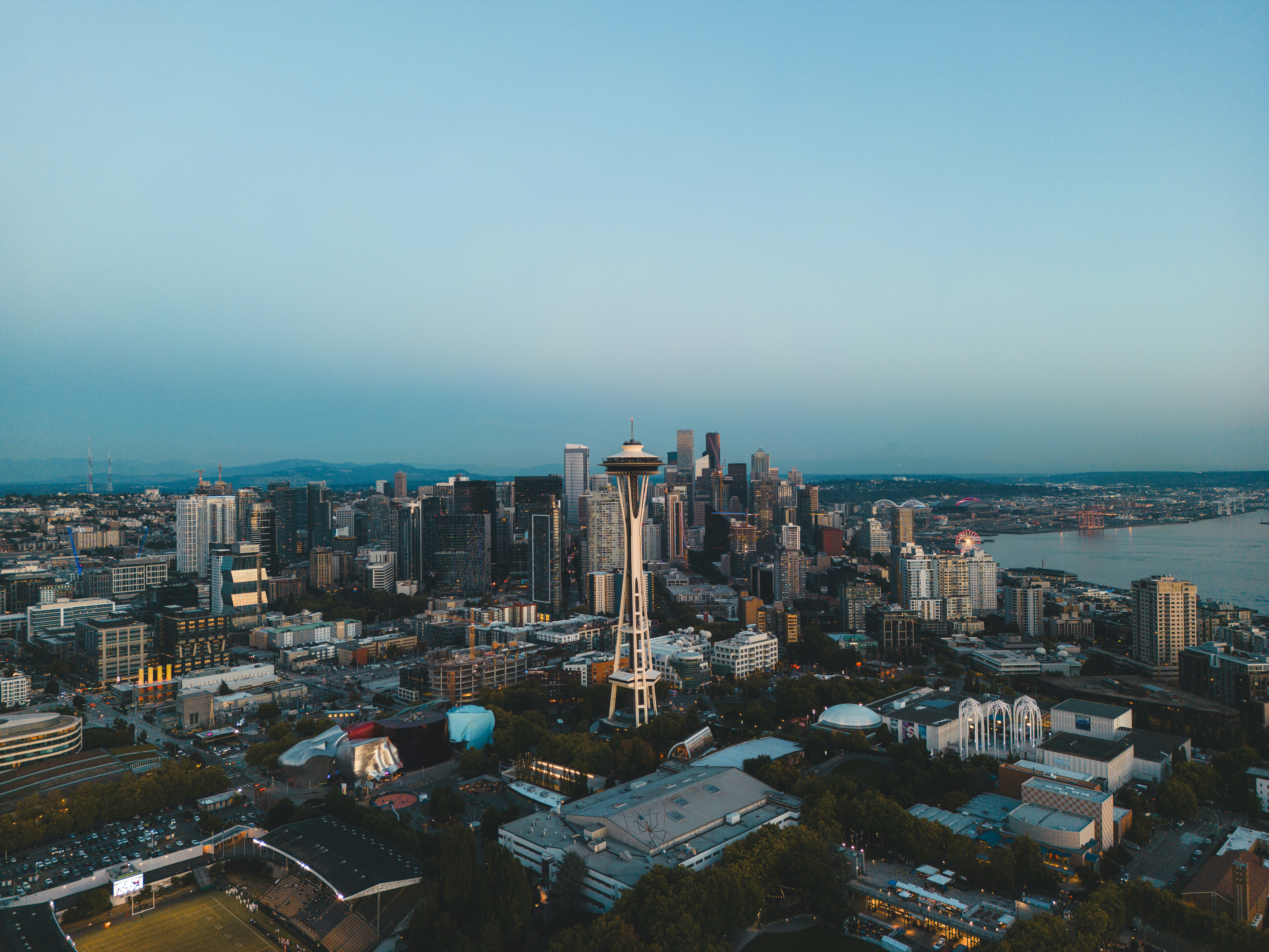 An aerial view of a city with tall buildings photo – Free Building ...