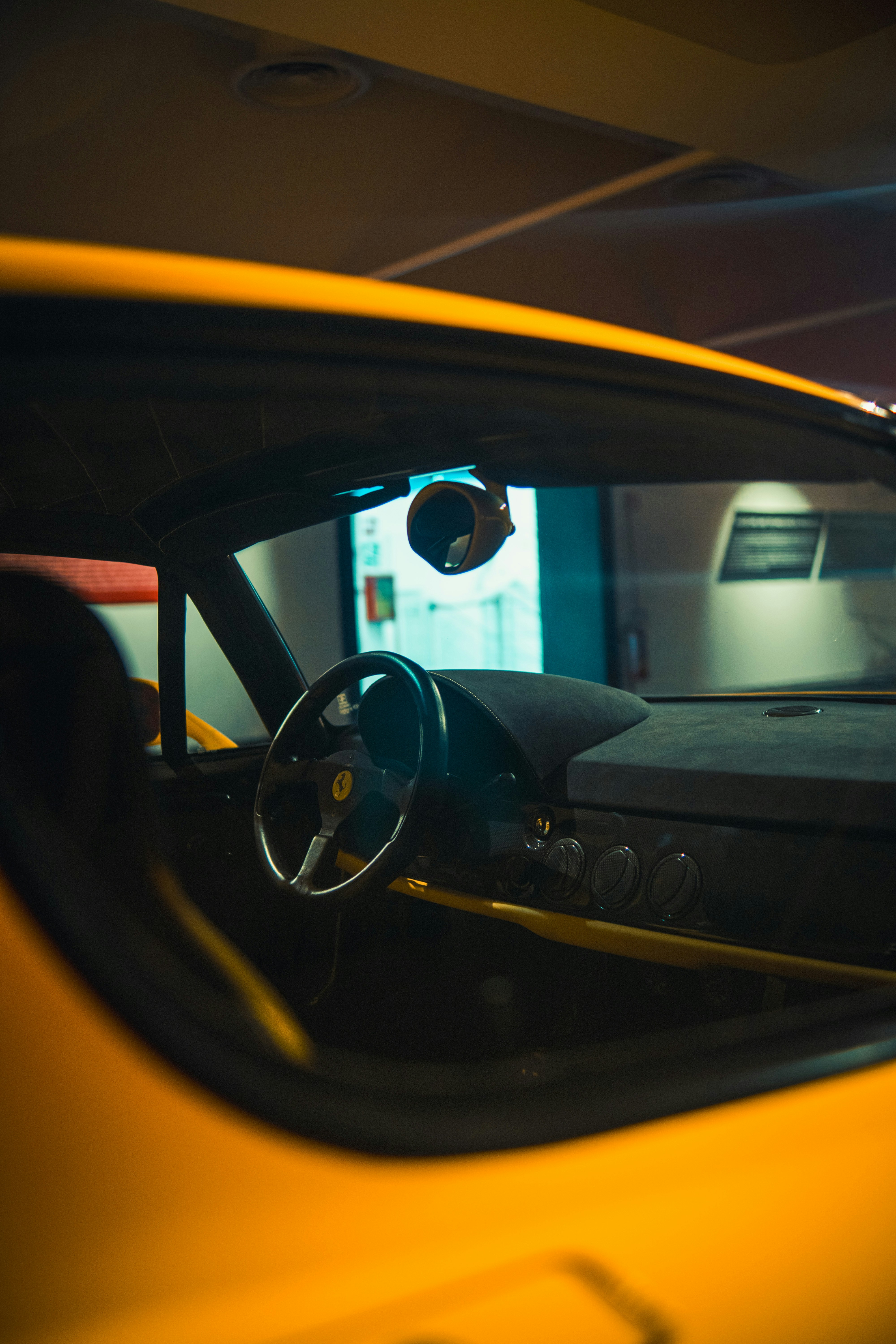 Gleam Through the Window: Inside a Yellow Ferrari Cockpit