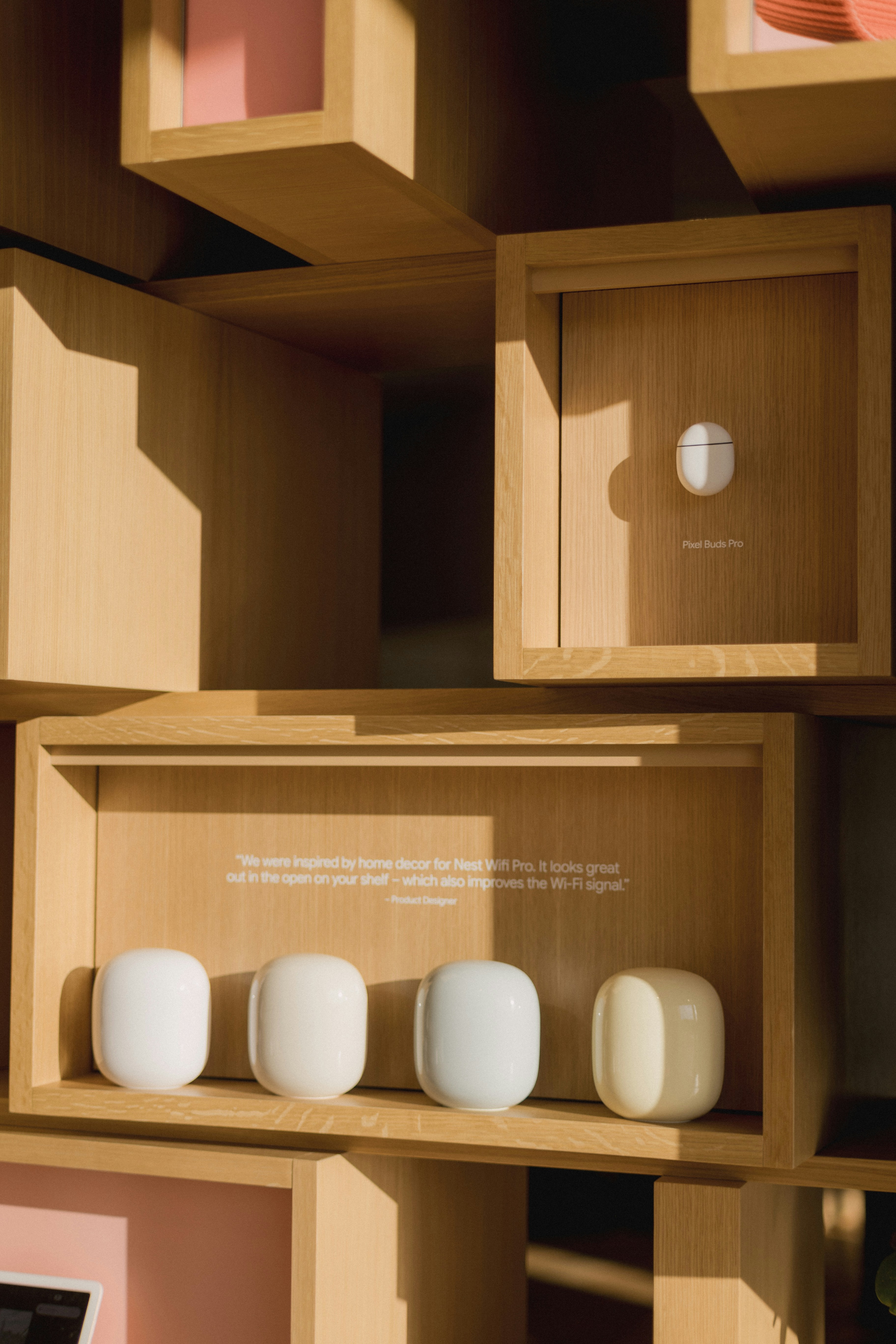 Soft Orbs on a Wooden Grid: Quiet Geometry in Display Boxes