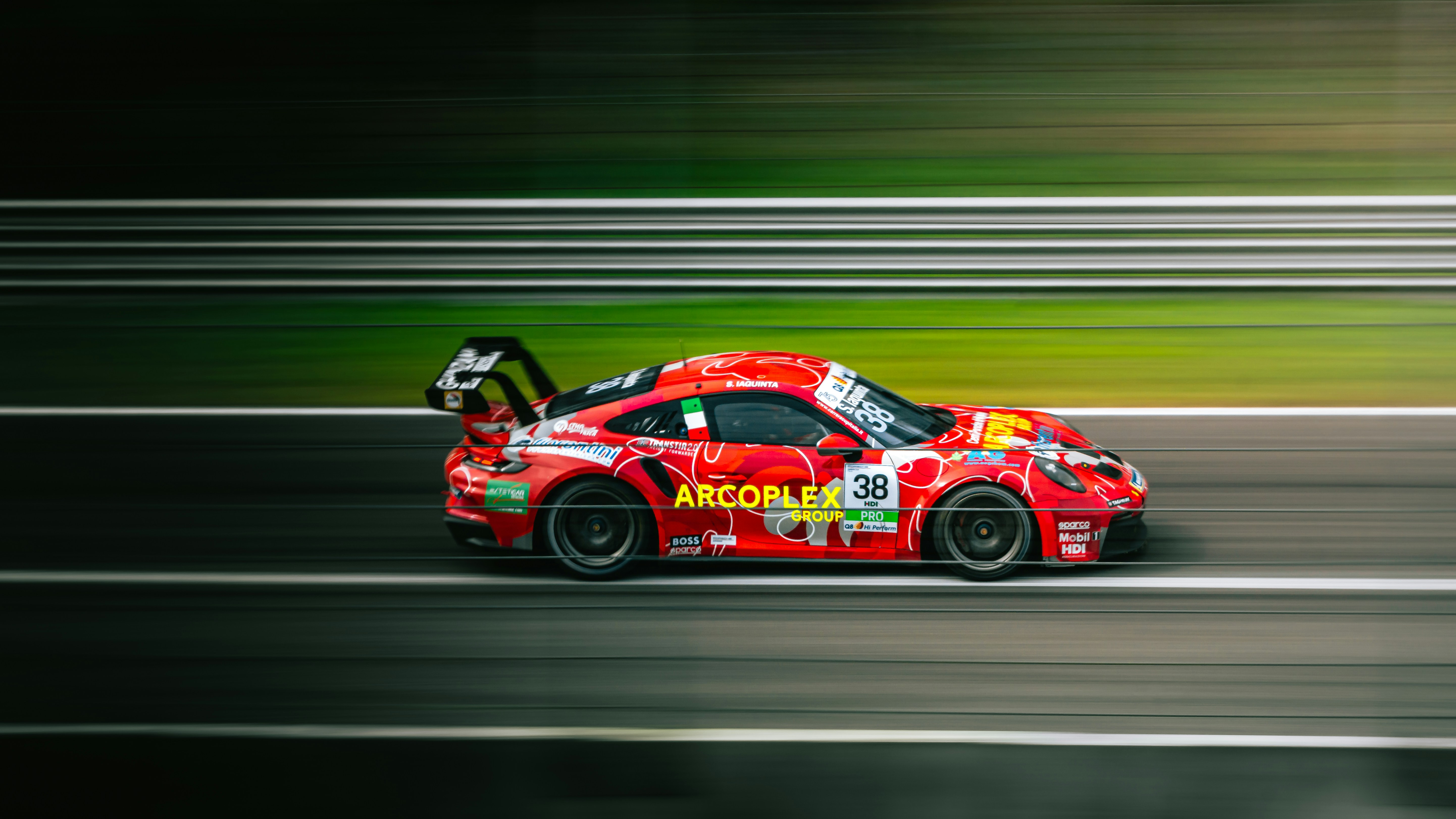 A red race car driving down a race track photo – Free Monza Image on ...