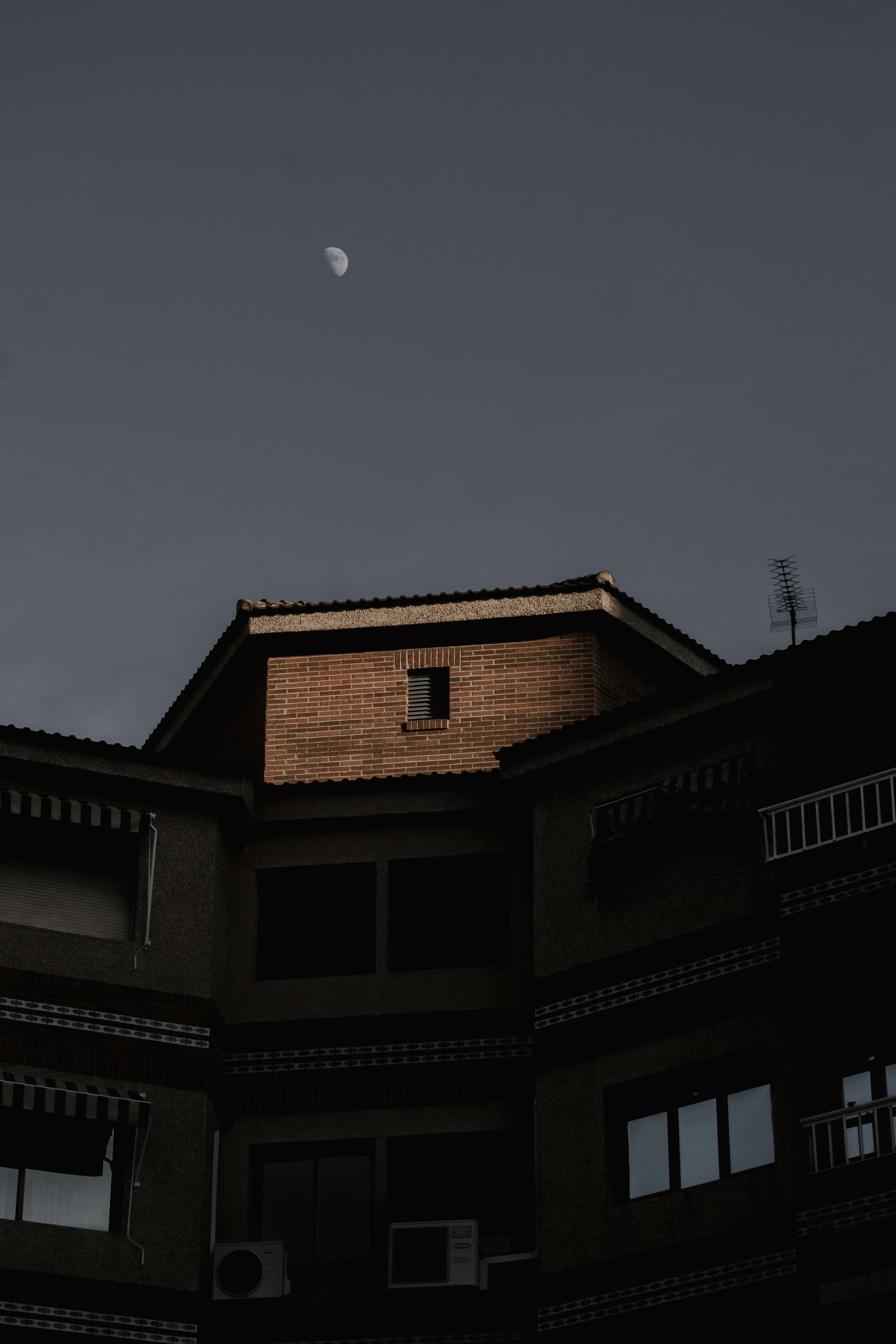 A building with a half moon in the sky photo – Free España Image on ...