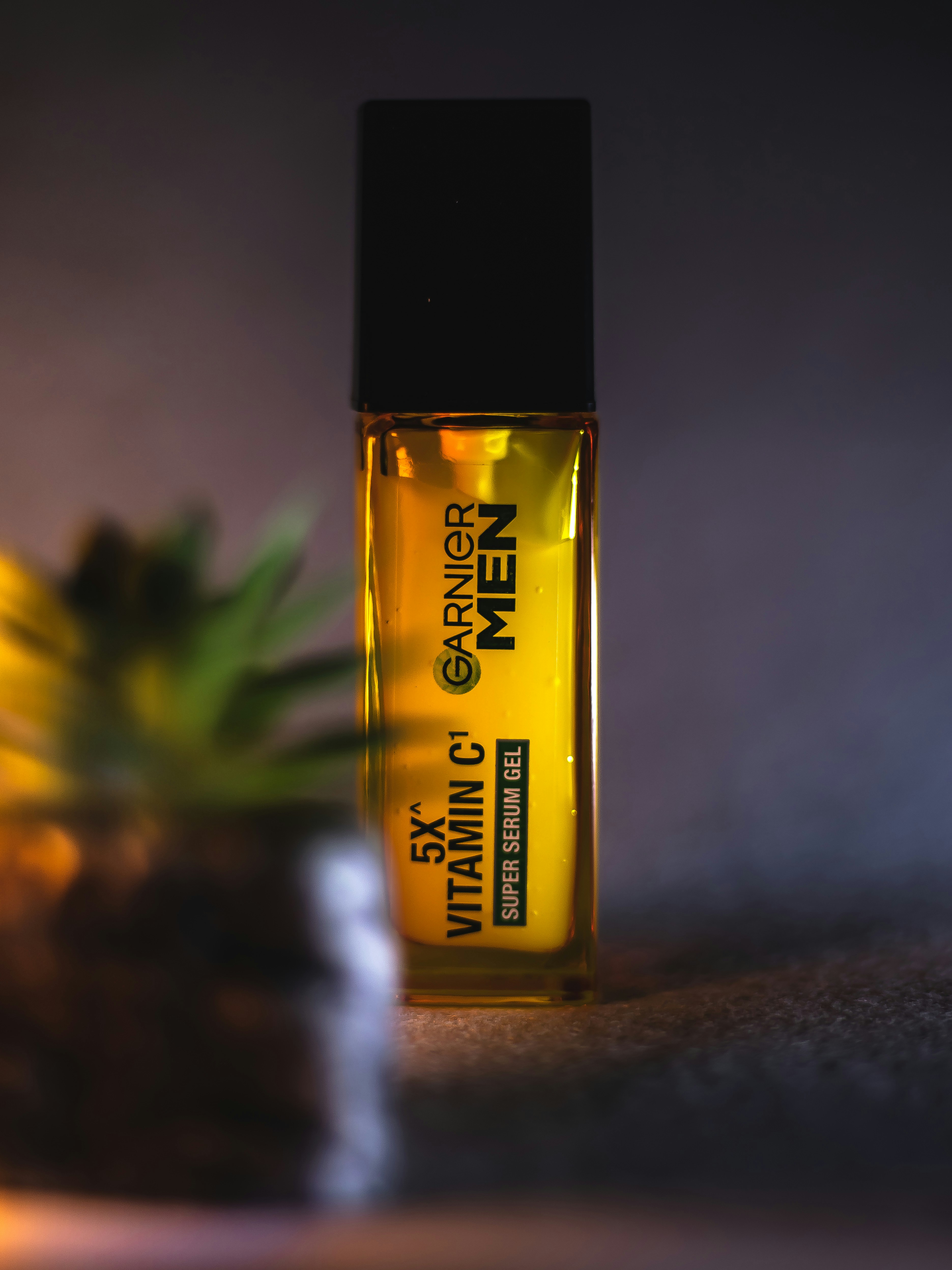 Amber Vessel: Garnier Men Vitamin C Serum in a Quiet Studio Glow