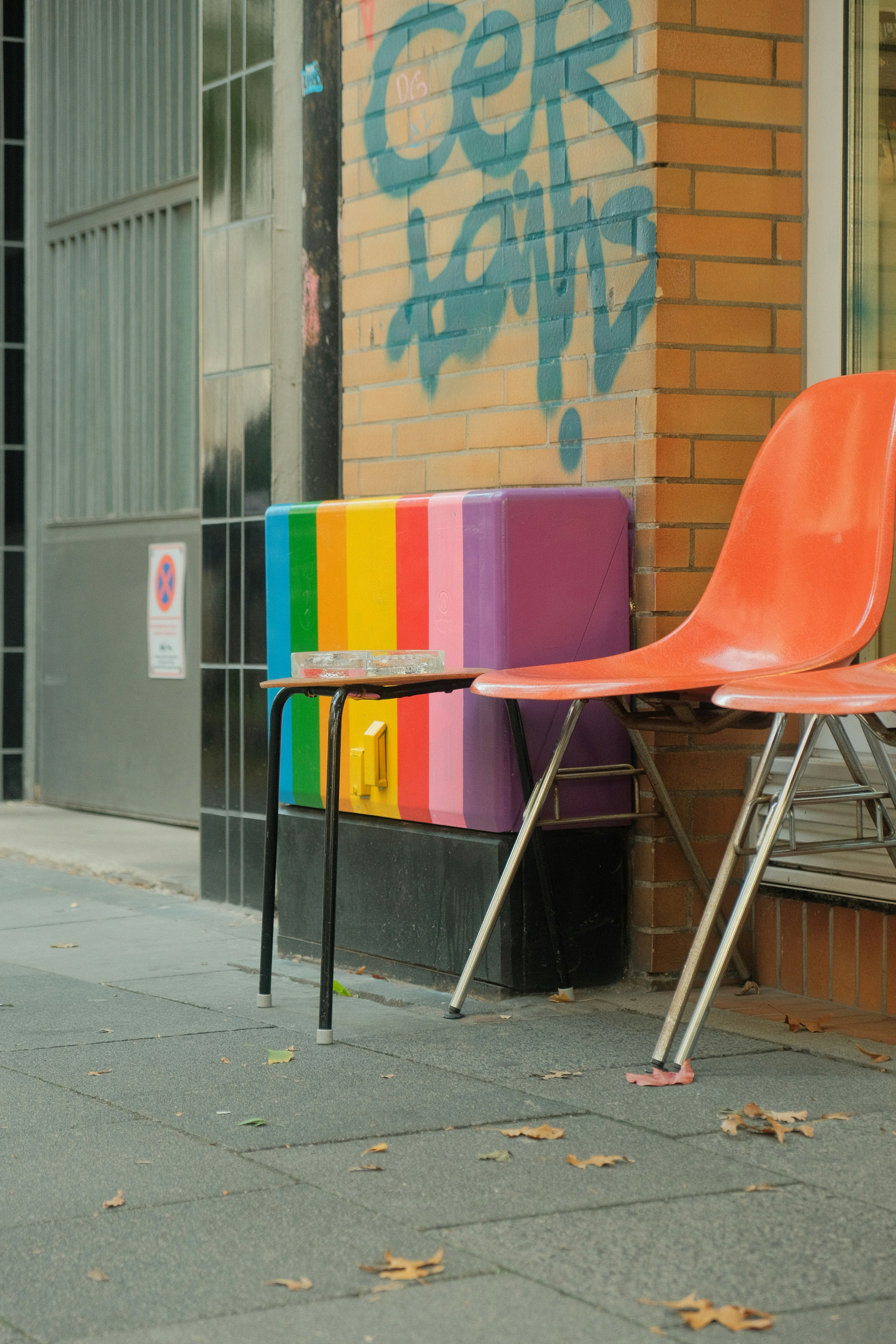 Rainbow Panel and Orange Chair: A City Corner in Color