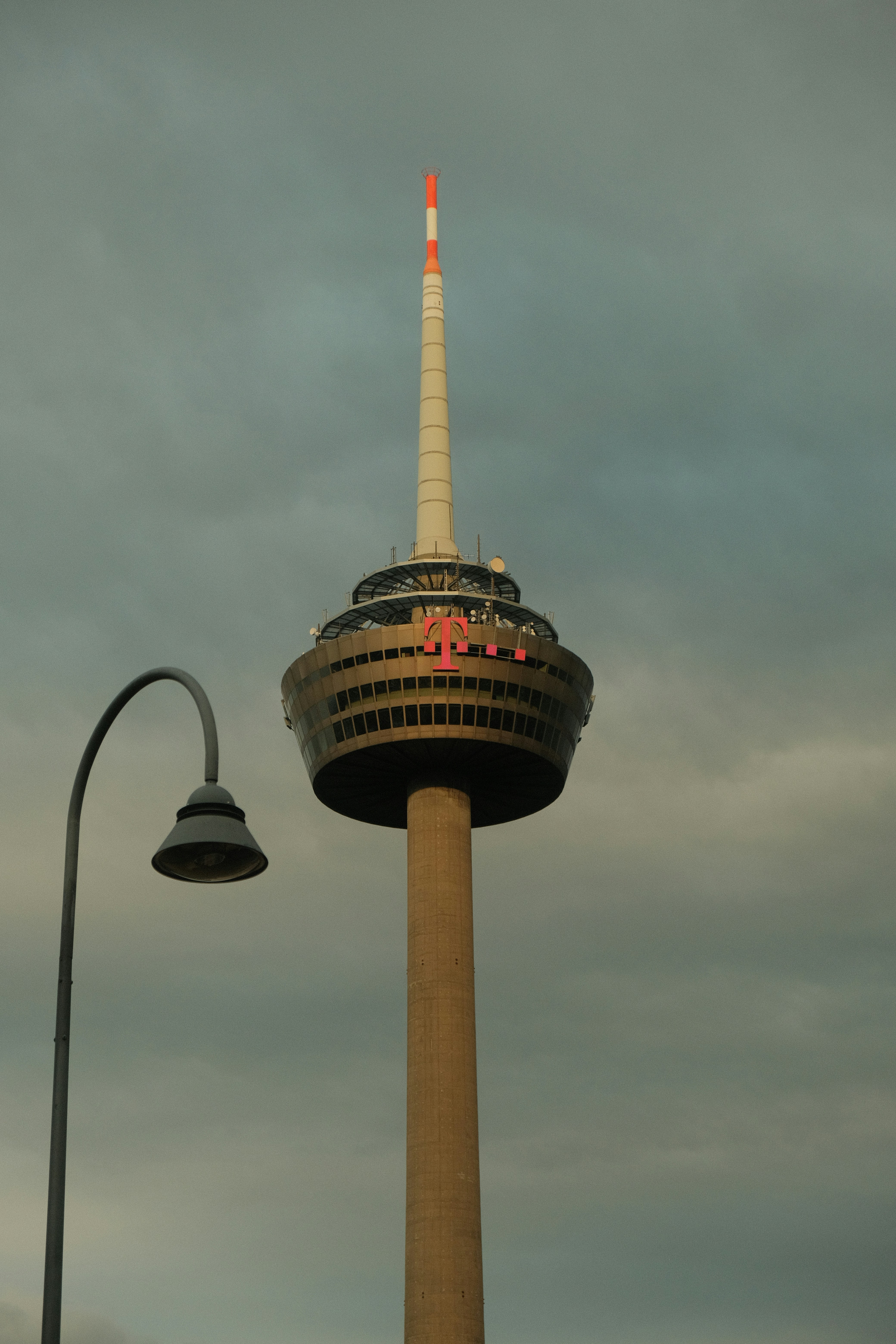 A tall tower with a red and white flag on top photo – Free Cologne ...
