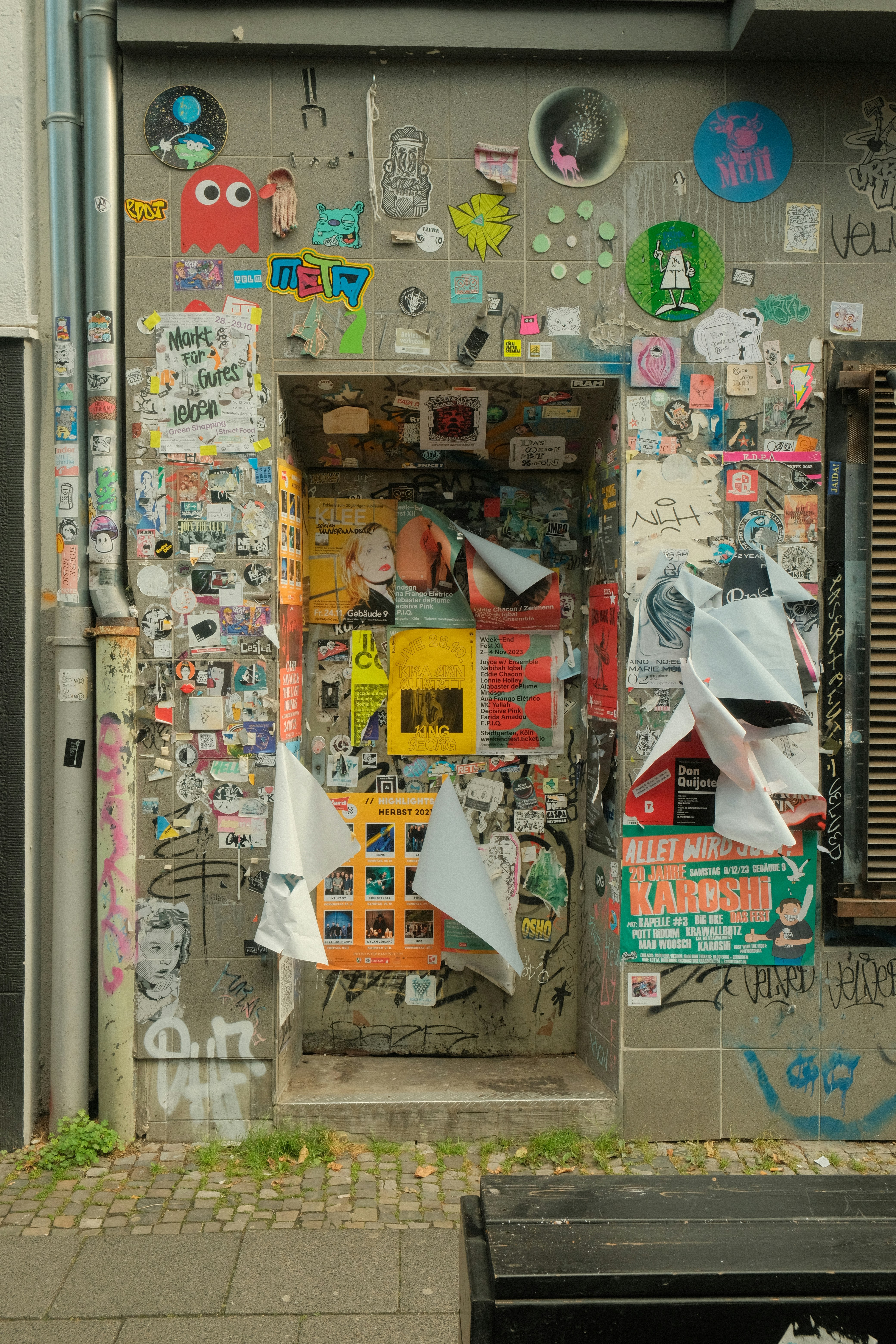 Stickered Portal: A Graffiti-Clad Doorway Draws You Into a Dense Urban Collage