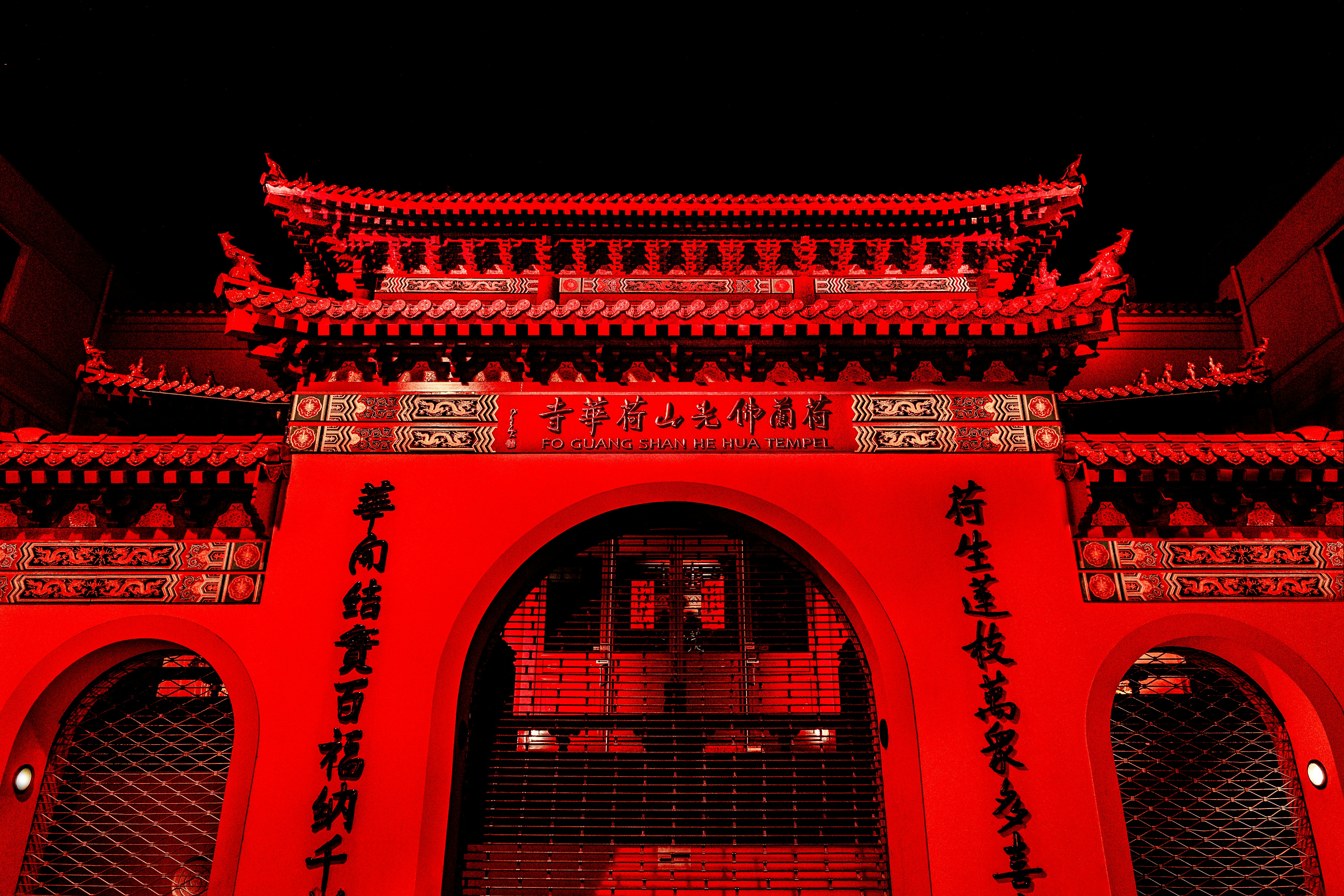 Crimson Gate at Night: Lantern-Illuminated Temple Arch in Red Glow