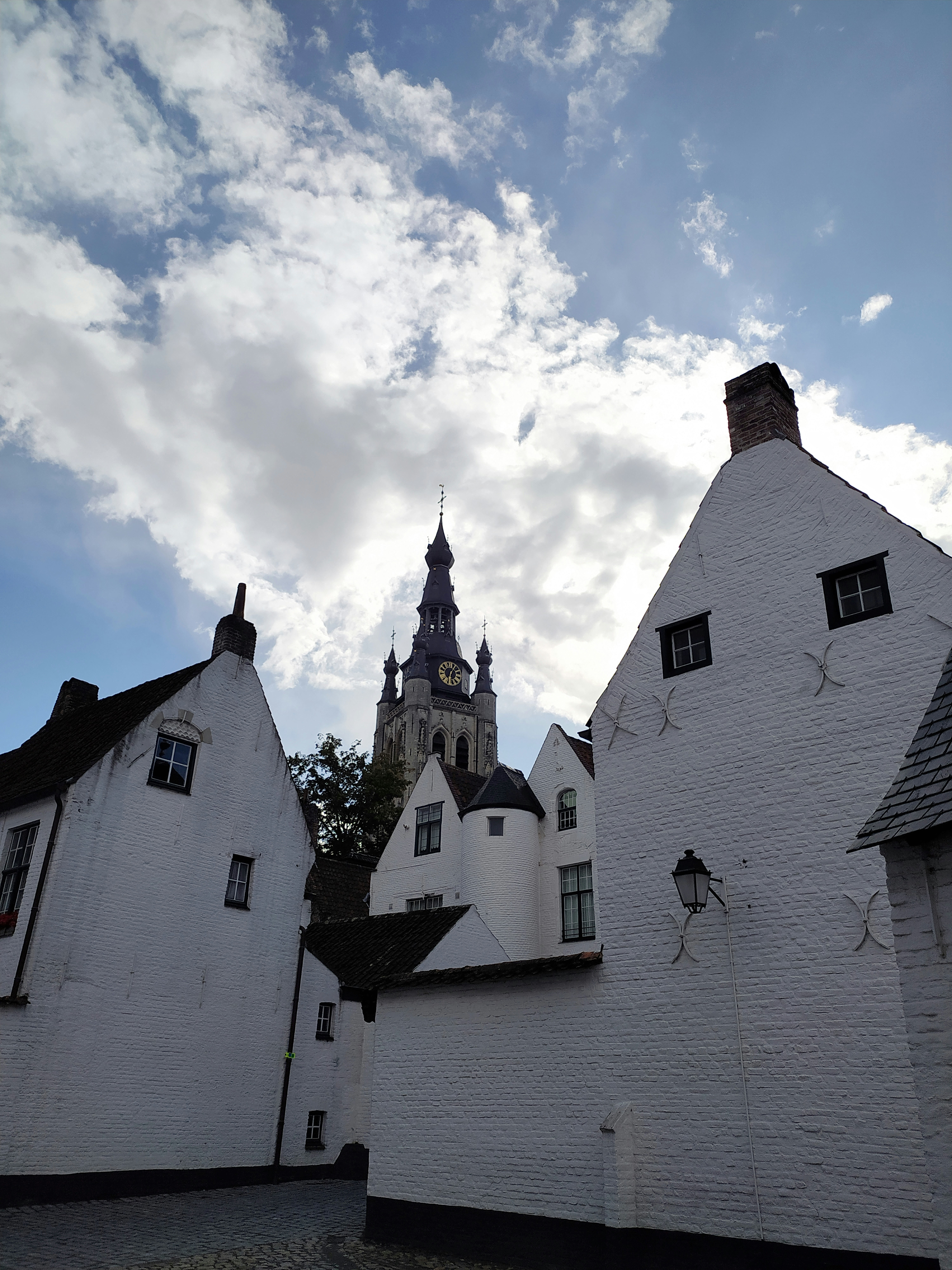 White-washed Gables and a Clocktower under a Sky of Clouded Light