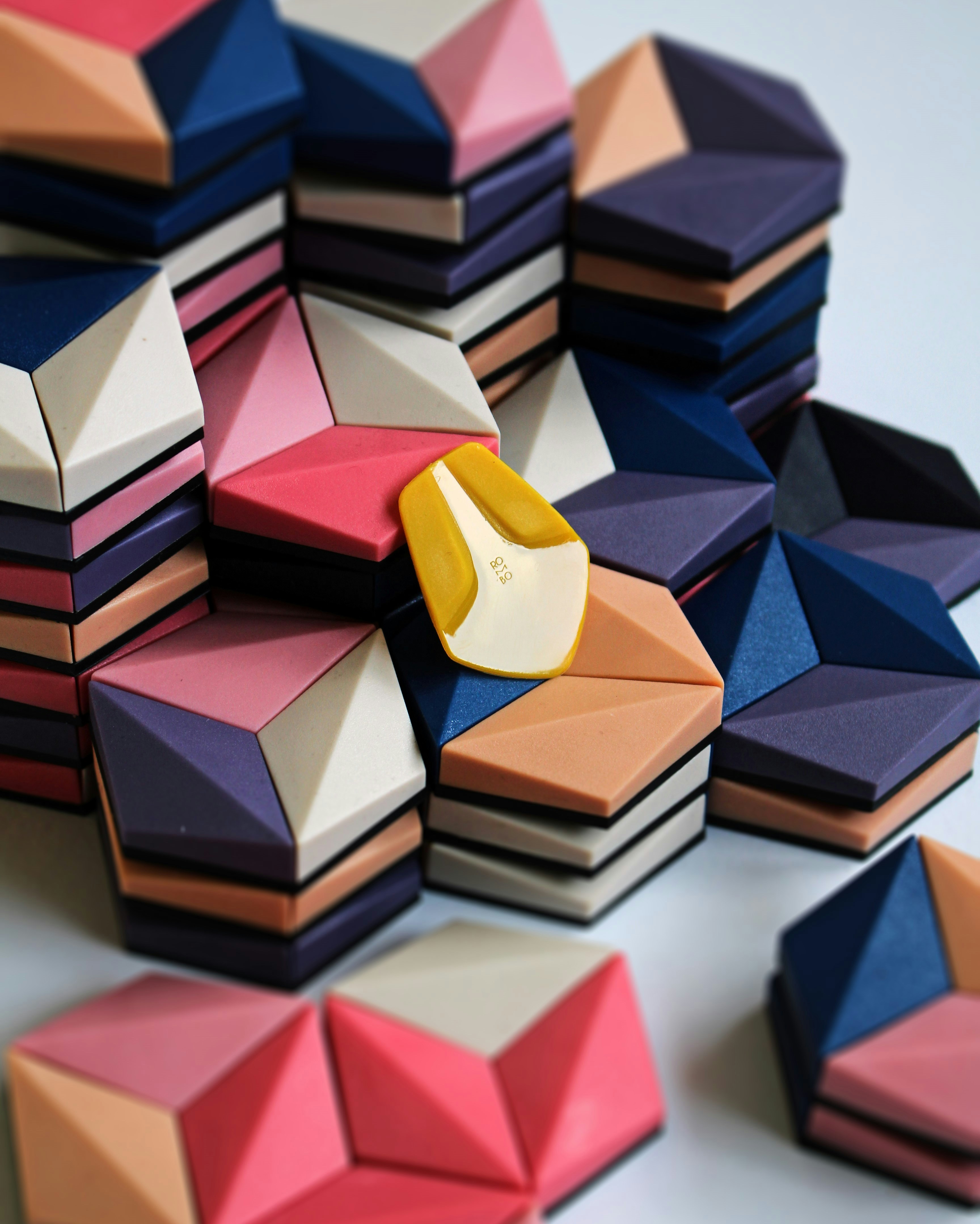 A pile of folded origami pieces on a table photo – Free Guitarpick ...