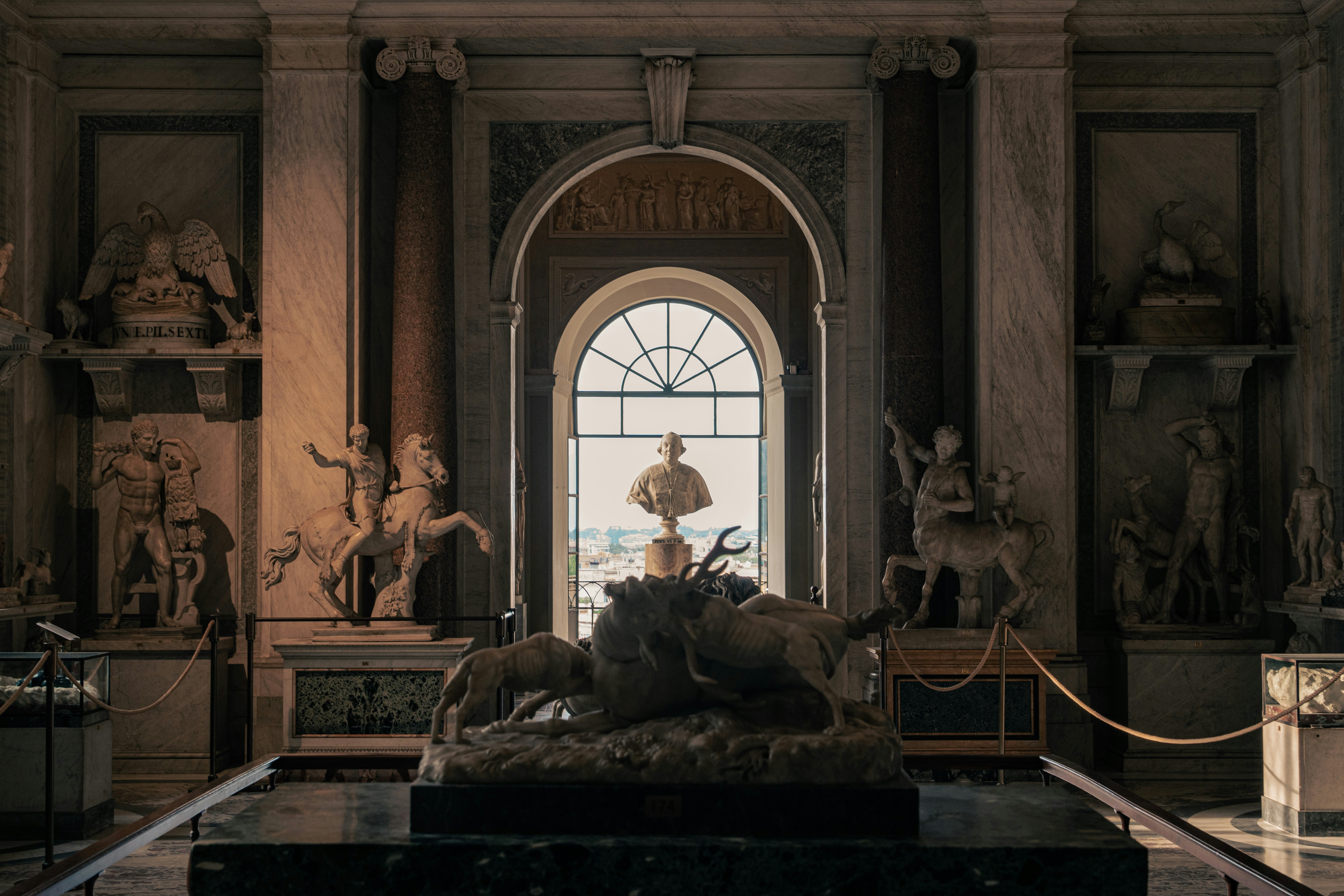 Marble Sentinel Beneath the Archway Window