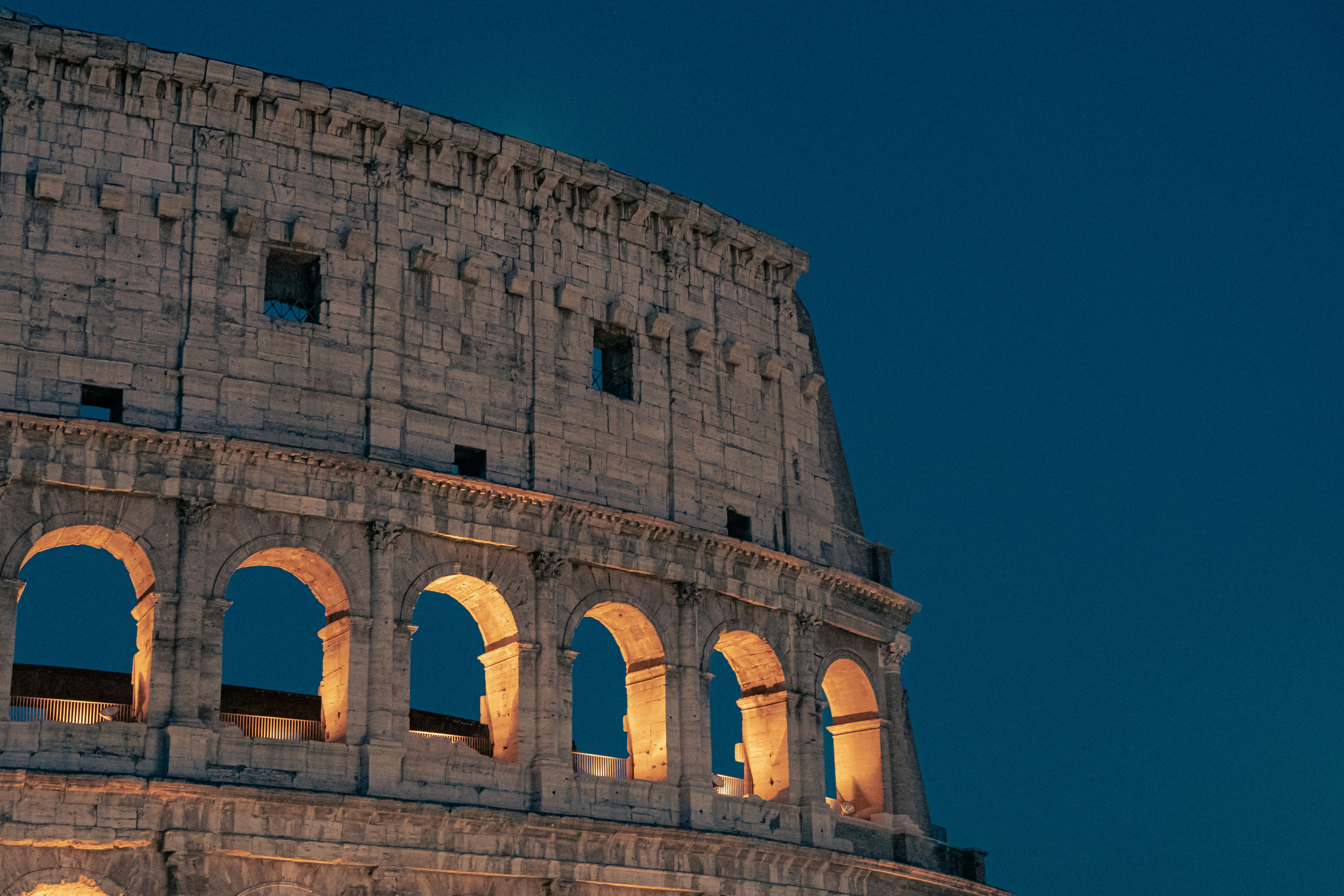 A very tall building with a clock on it's side photo – Free Rome Image ...