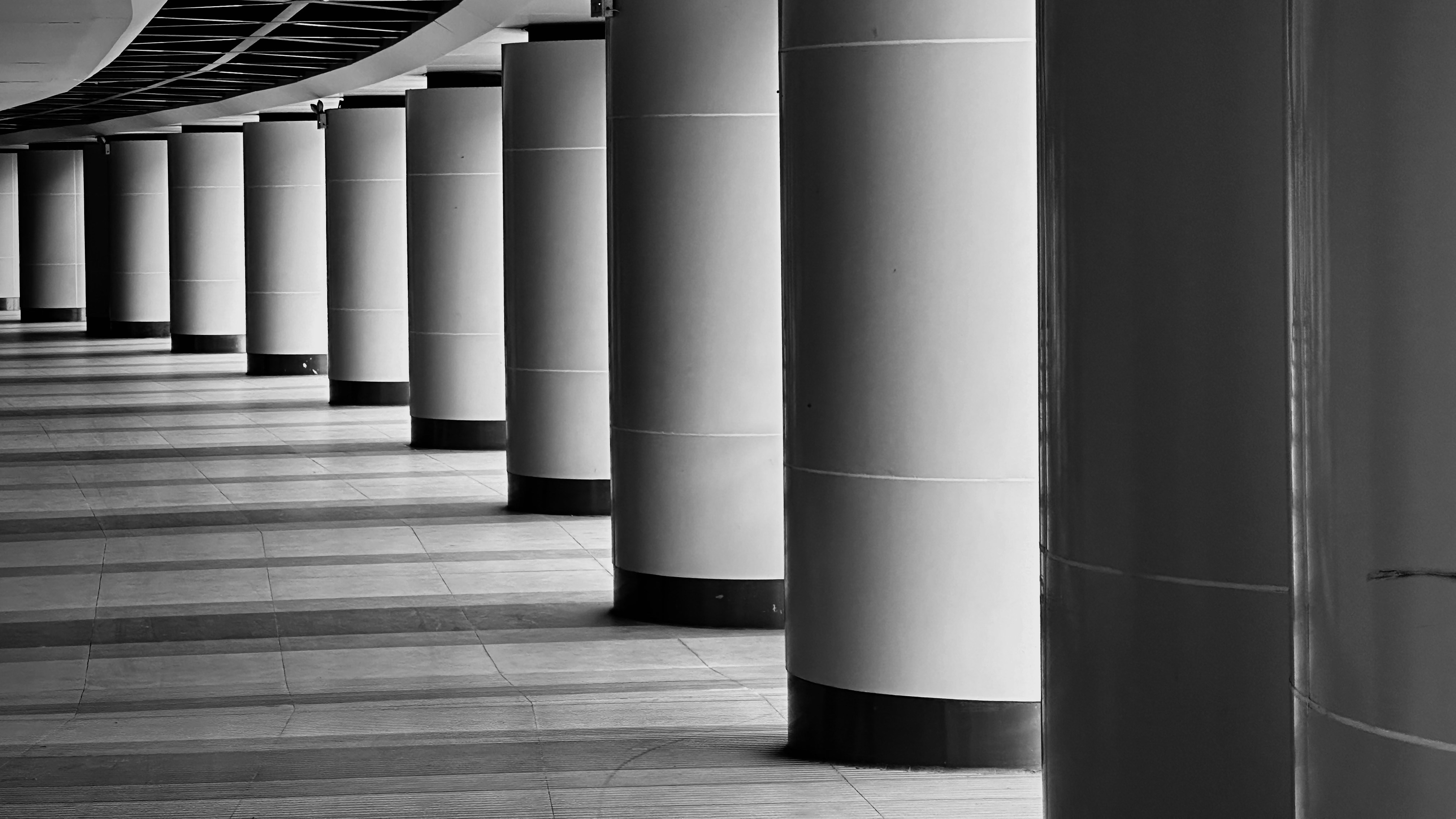 Black and white photograph of a row of columns photo – Free Light and ...