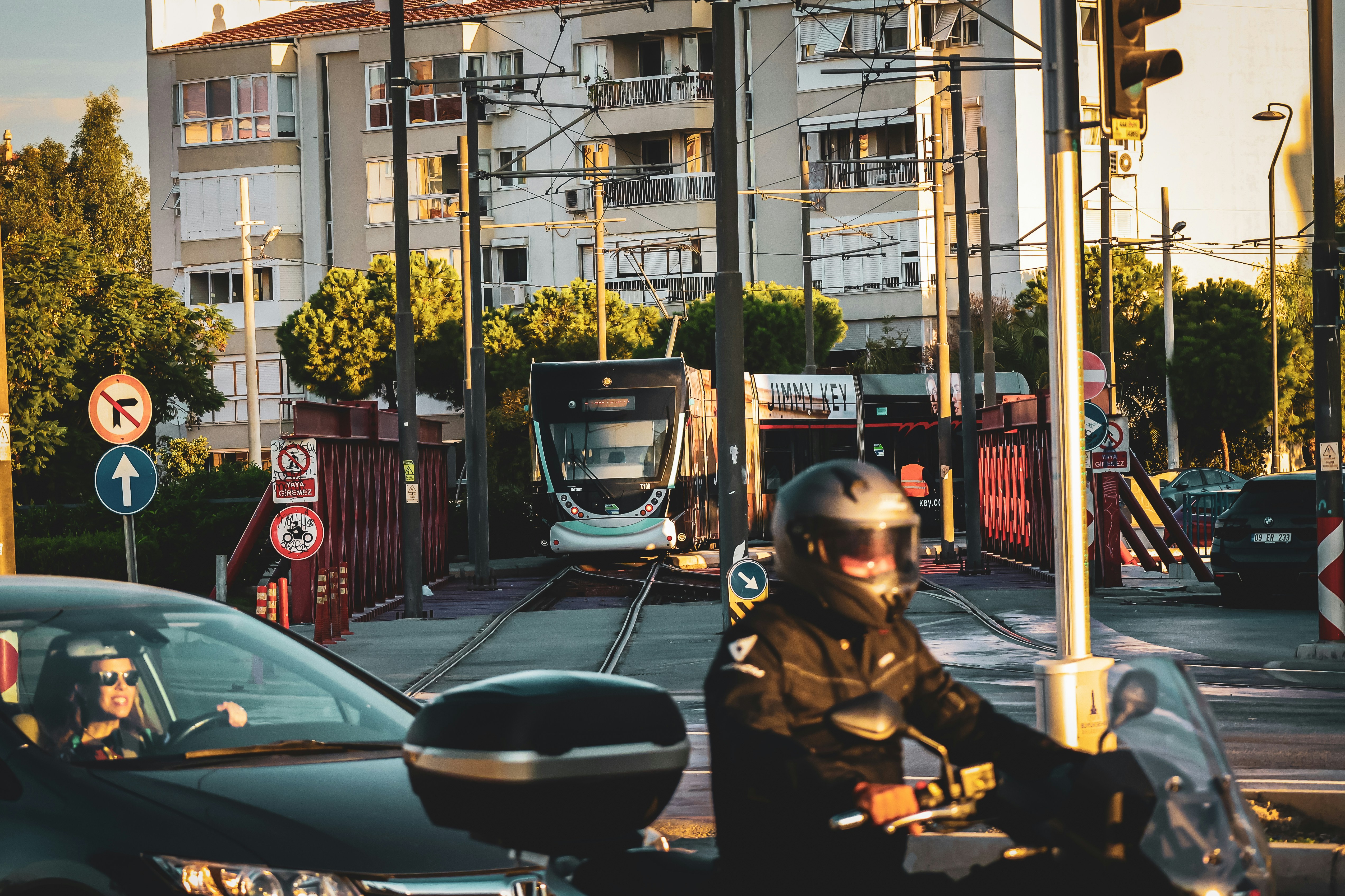 Dusk Crossing: A Streetcar Wends Through a City's Busy Artery