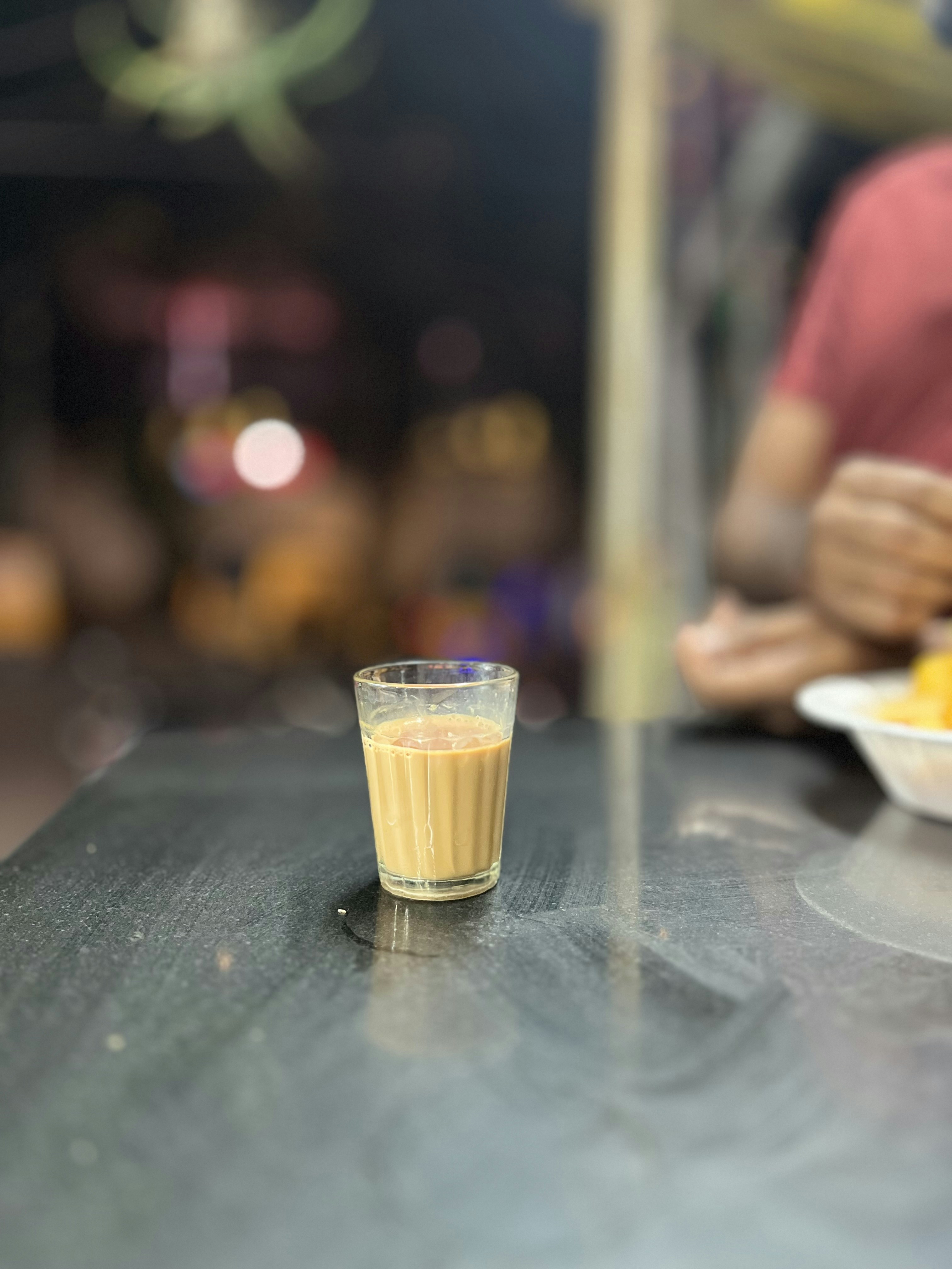Creamy Glass in Soft Blur: A Quiet Moment at the Café