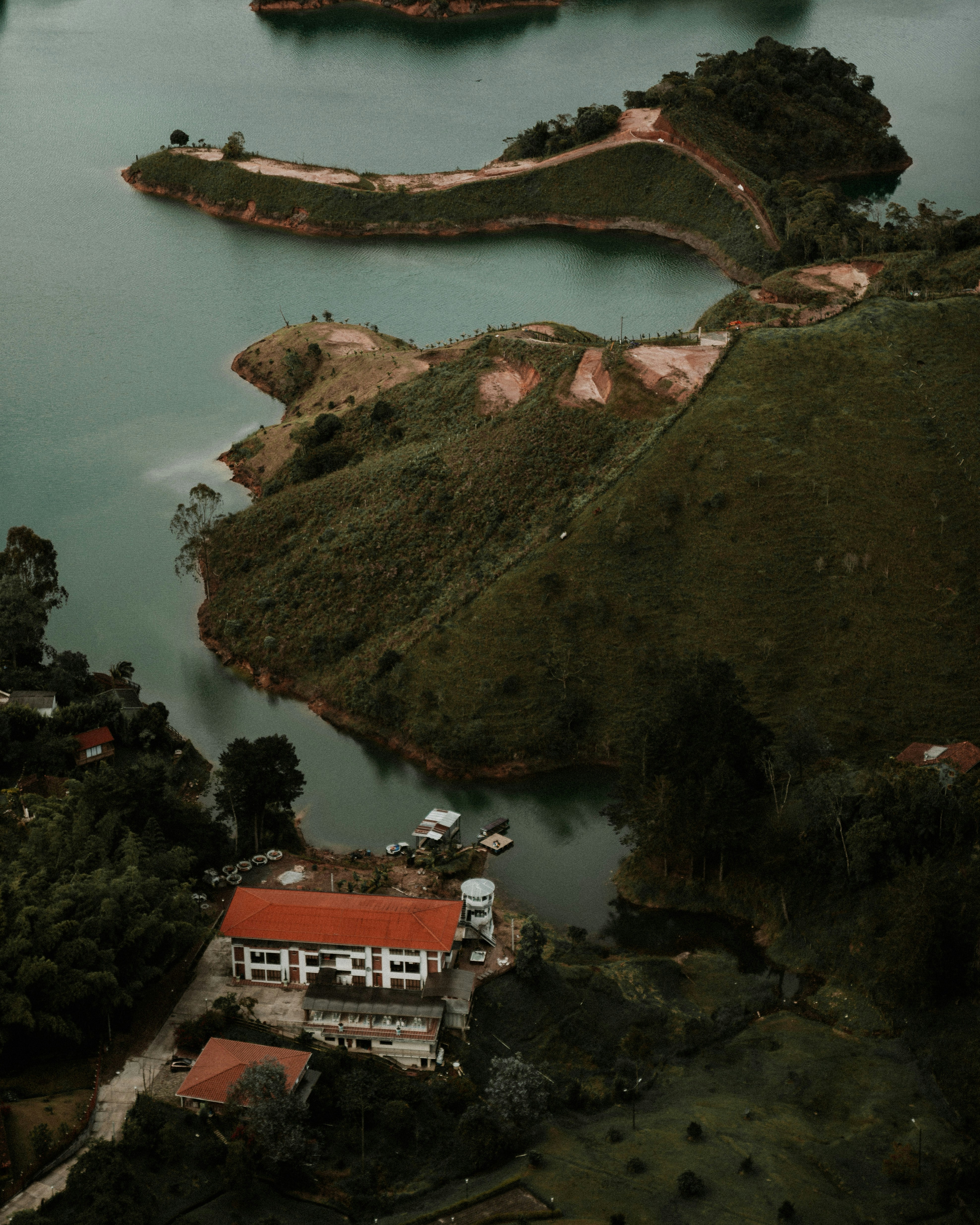 Terraced headland over turquoise water: a hillside settlement at the water's edge