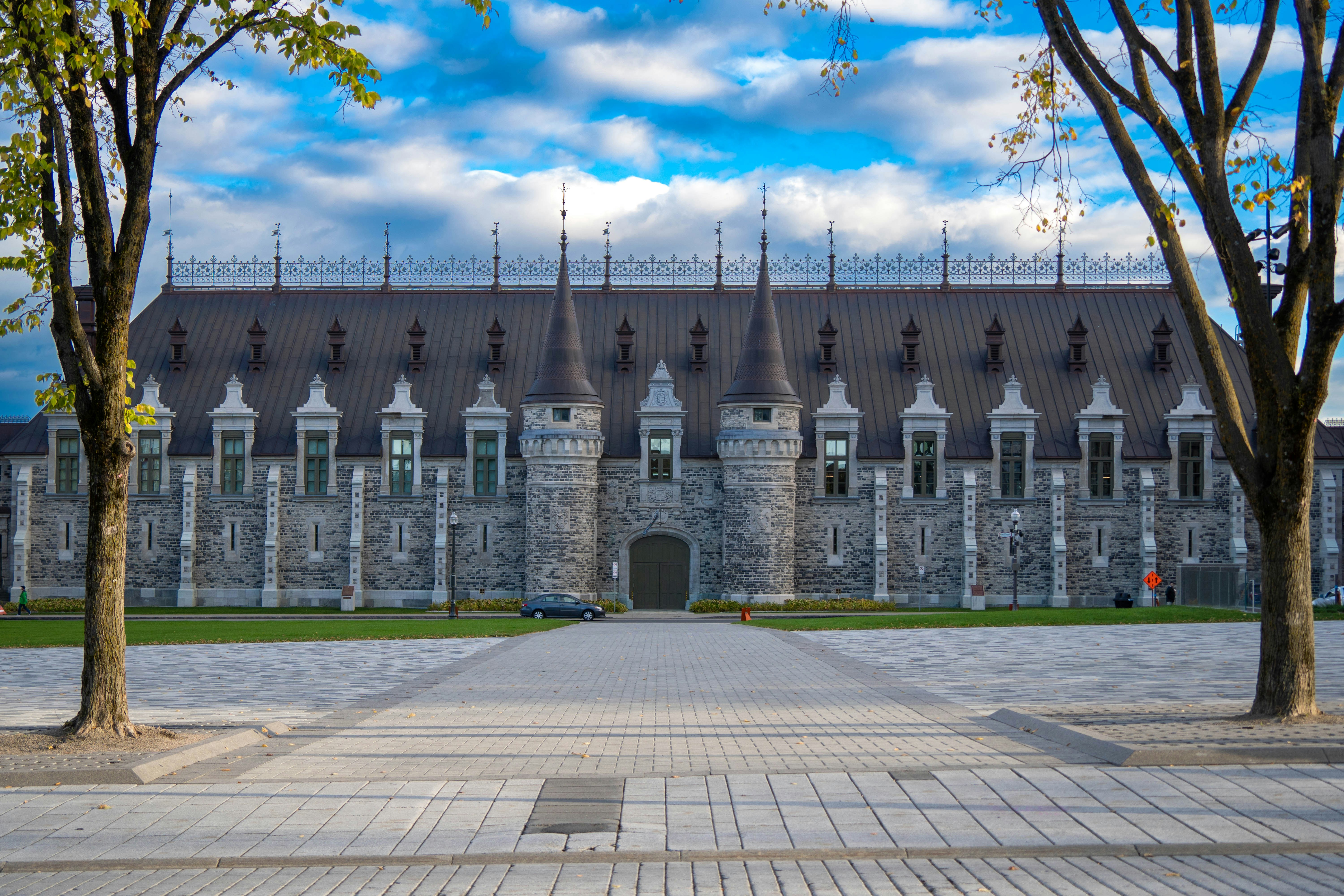 A large castle like building with a clock tower photo – Free Building ...