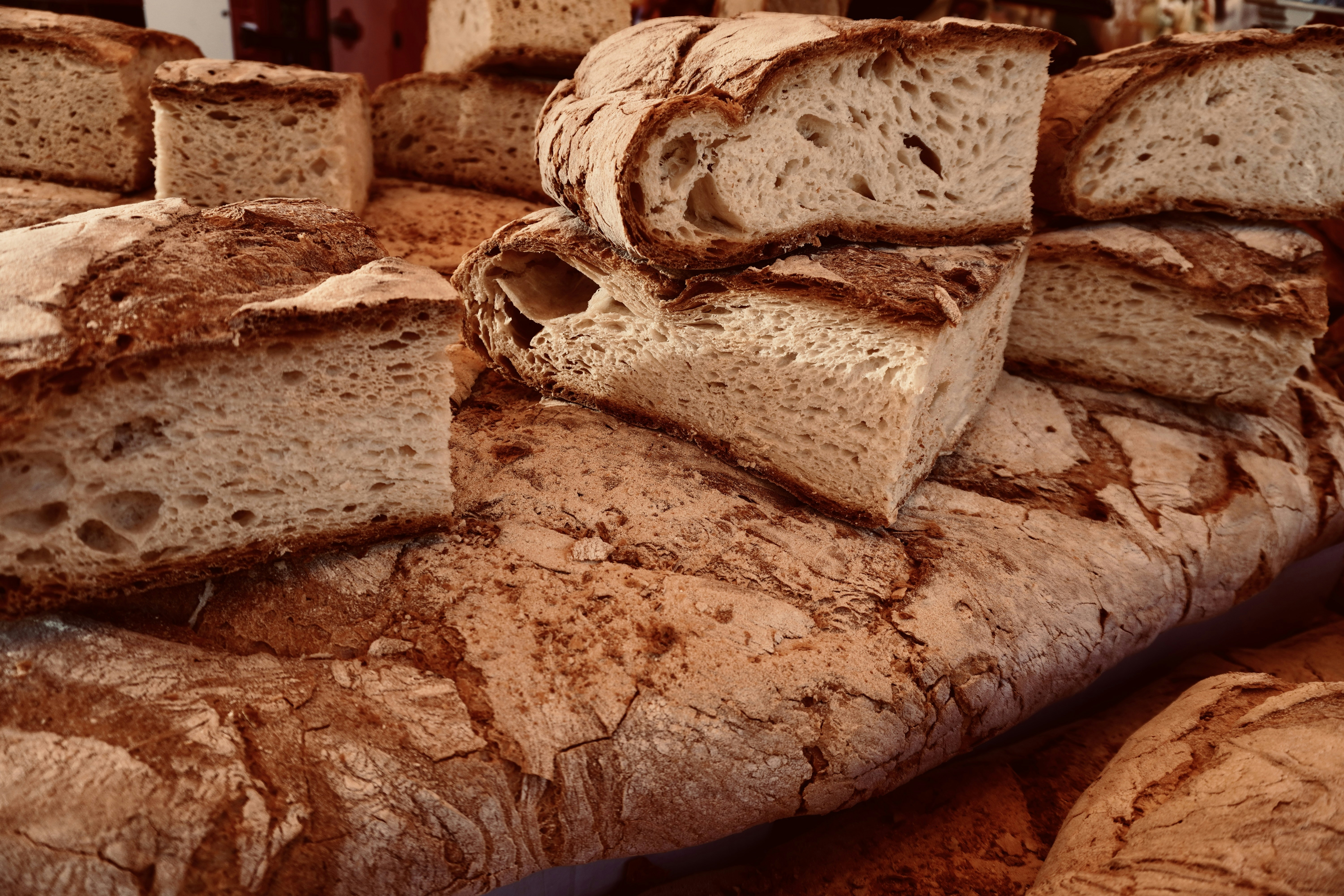 Crusty Geometry: Close-Up of Rustic Bread Loaves in Warm Light