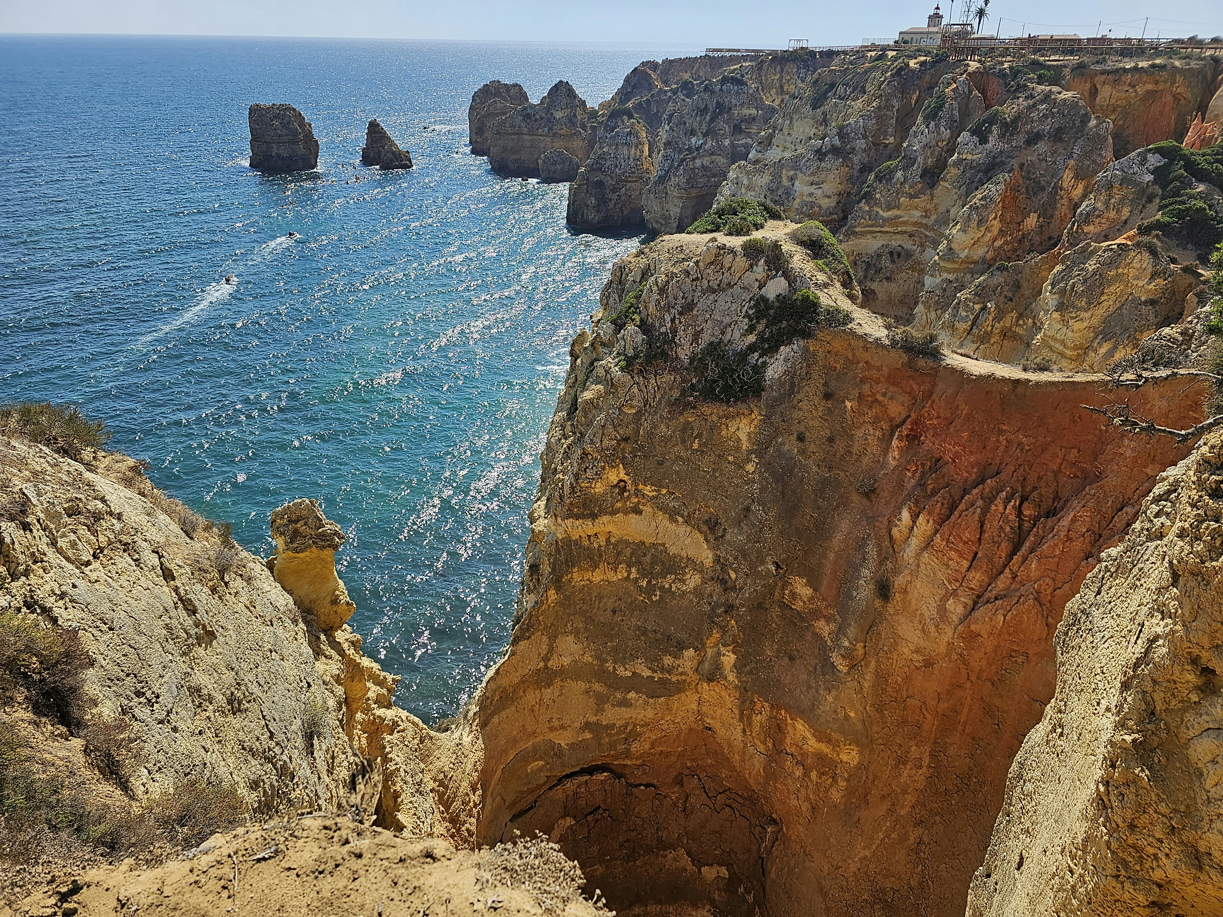 Cliffside Ocean Vista: Rust, Rock, and Deep Blue