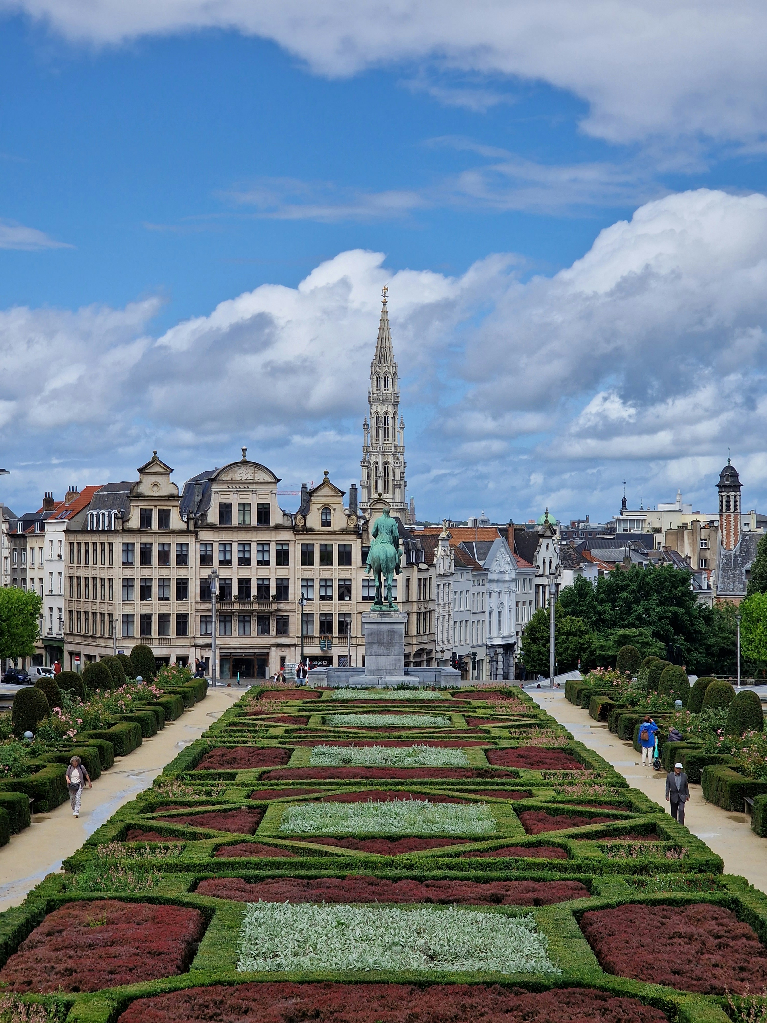 Equestrian Axis: Garden Tiers Framing a Spire-Backed Cityscape