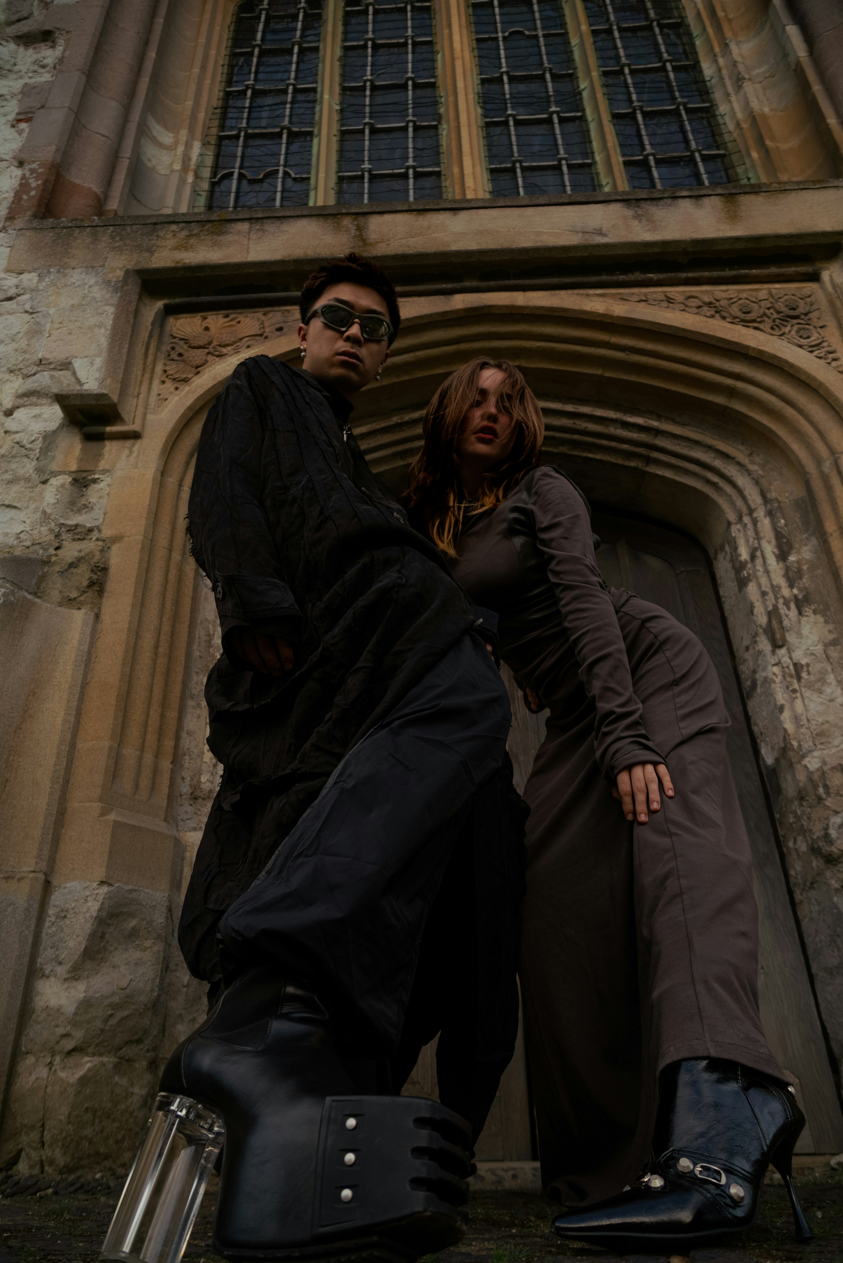 Two Figures at the Archway: Urban Grit Meets Shadowed Fashion