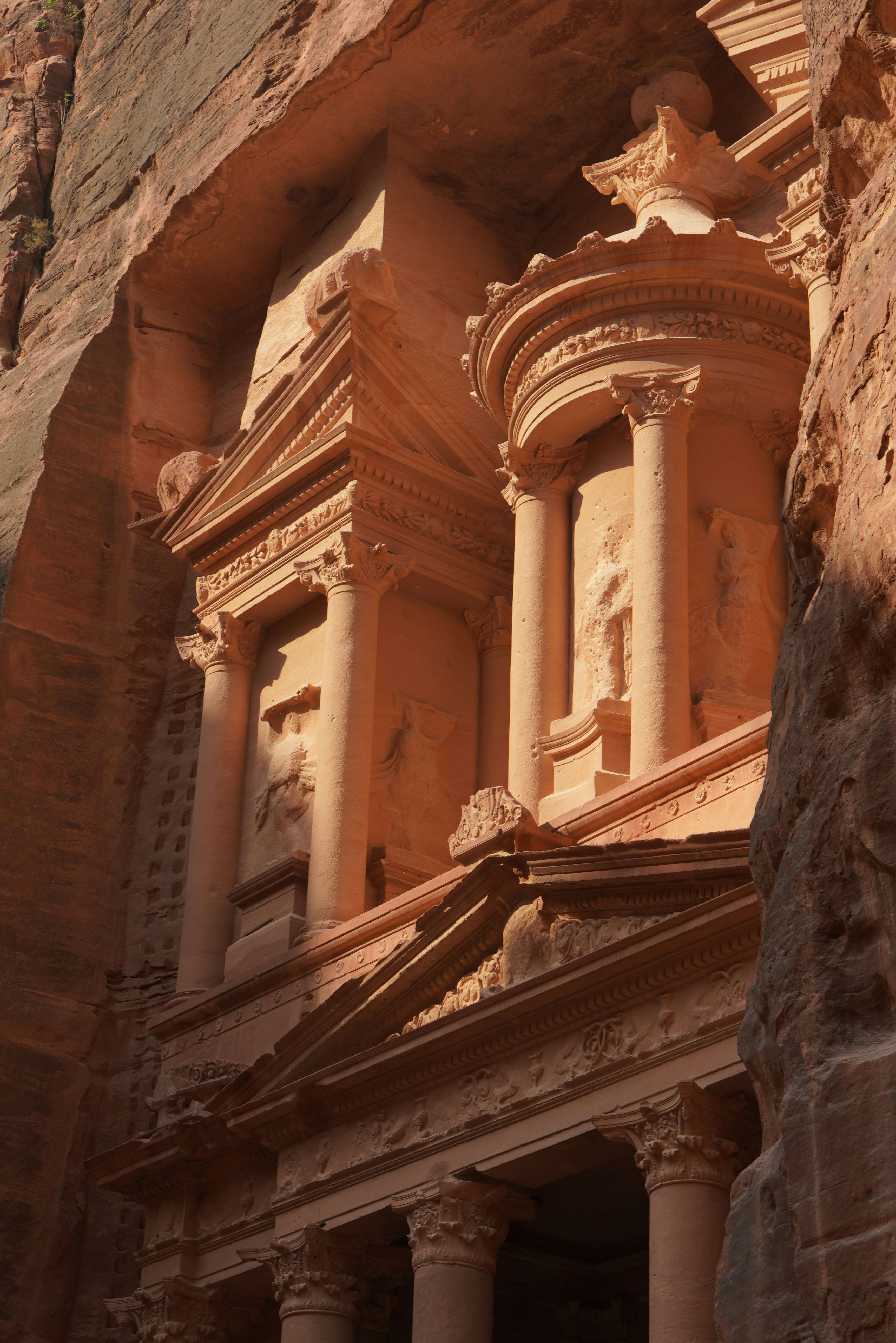 A building built into the side of a cliff photo – Free Petra Image on ...
