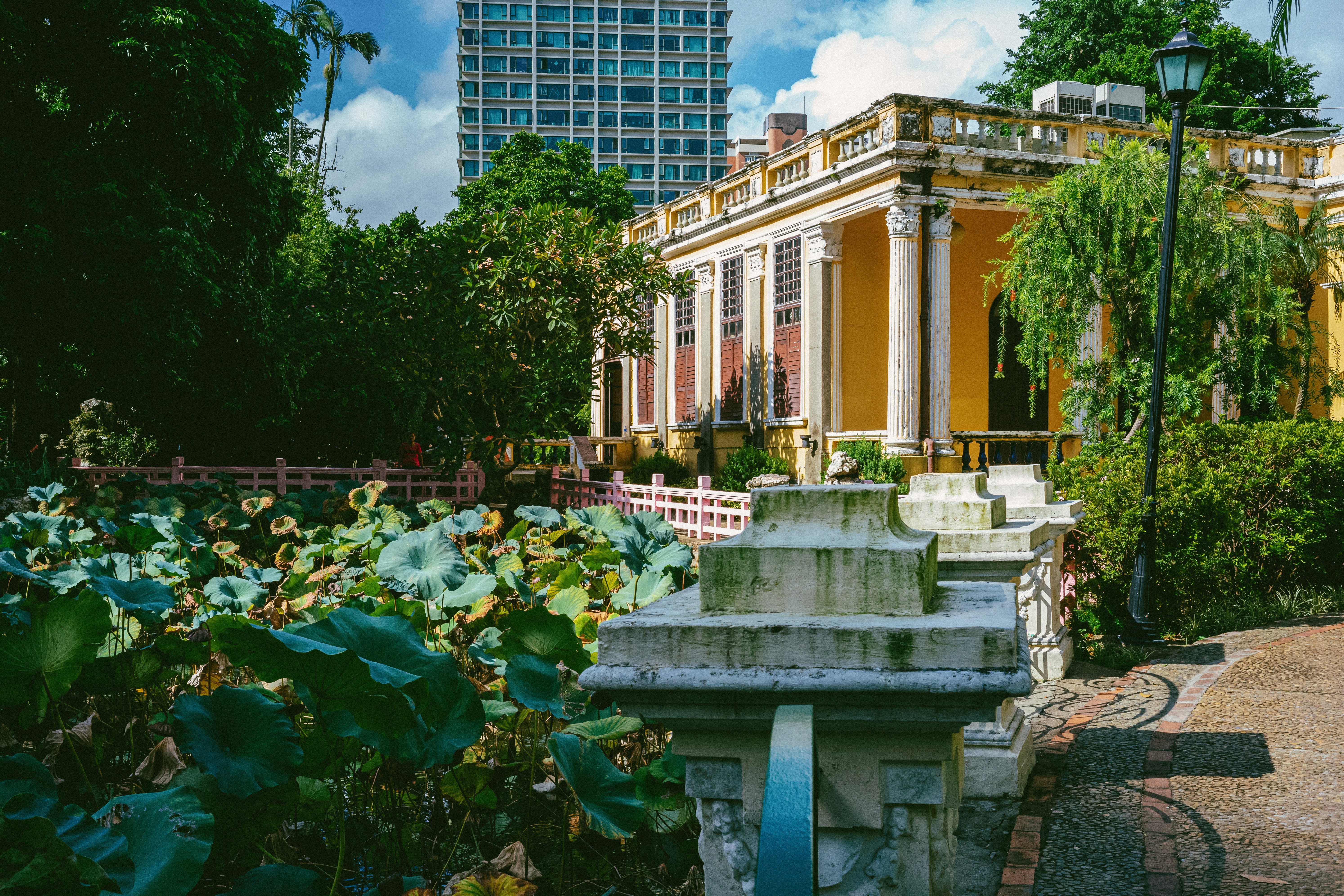 Terrace of Golden Columns Rising Above a Lotus Garden
