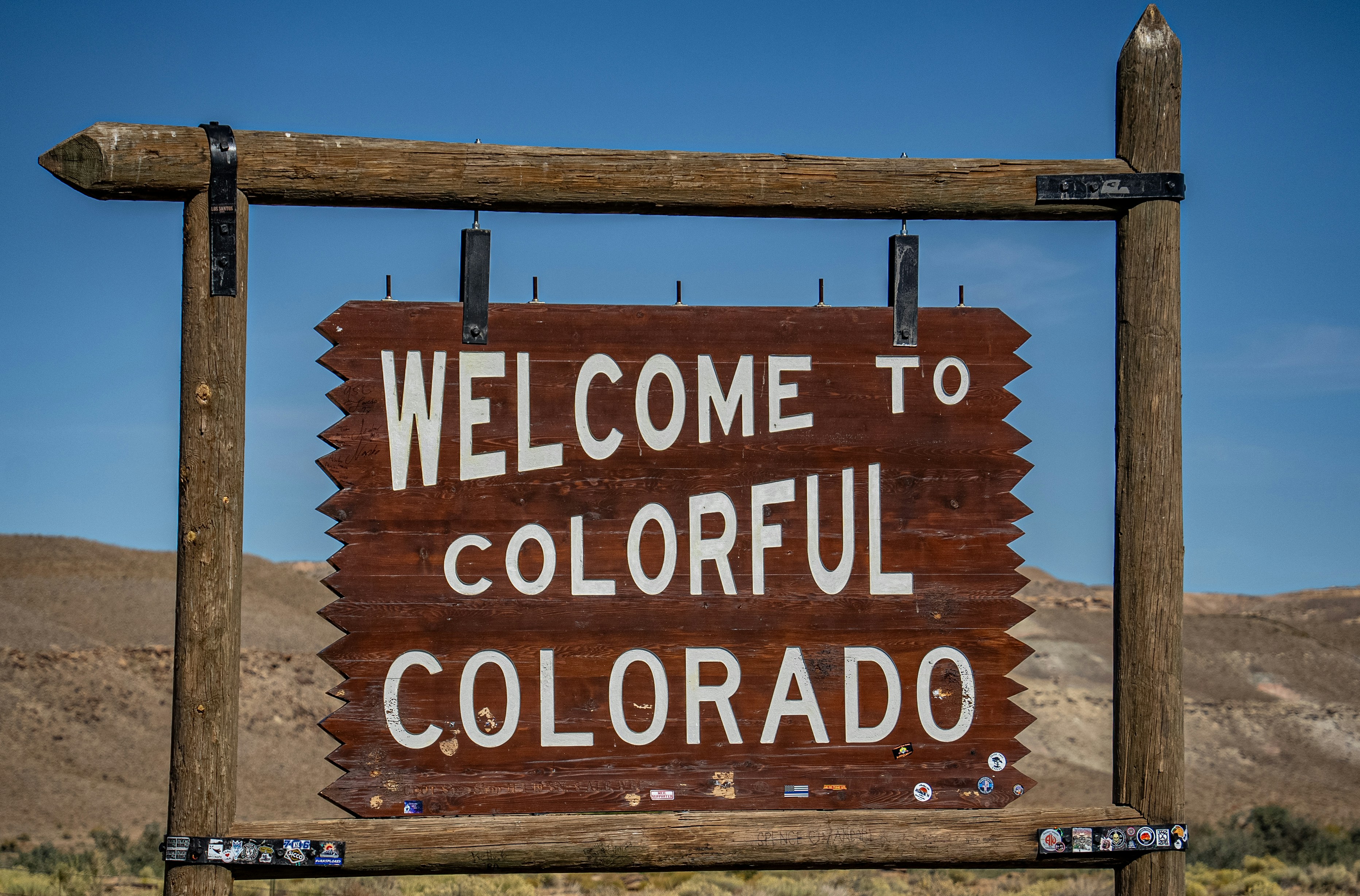 A welcome to colorful colorado sign in the desert photo – Free Sign ...