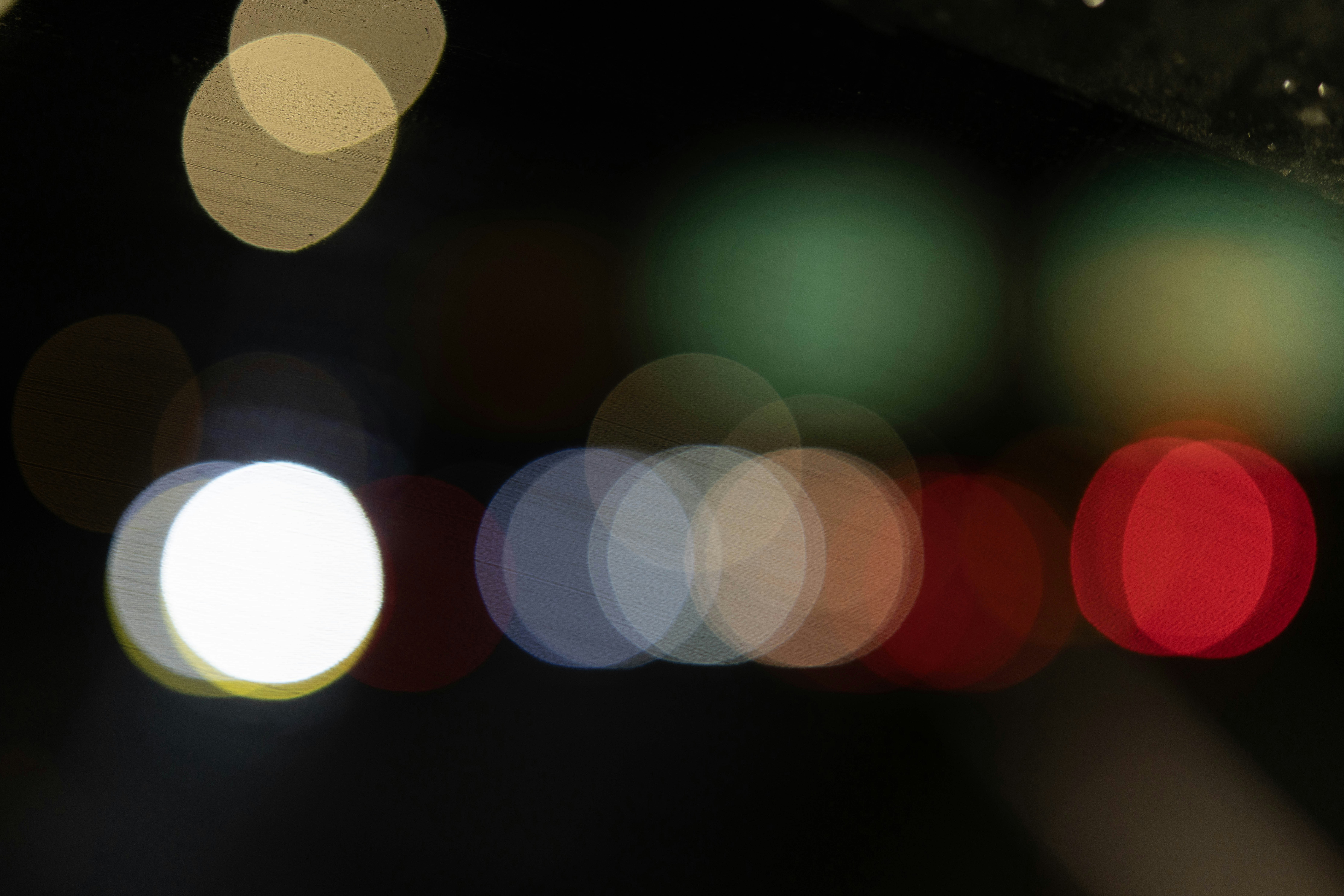 A blurry photo of a street light at night photo – Free Night Image on ...