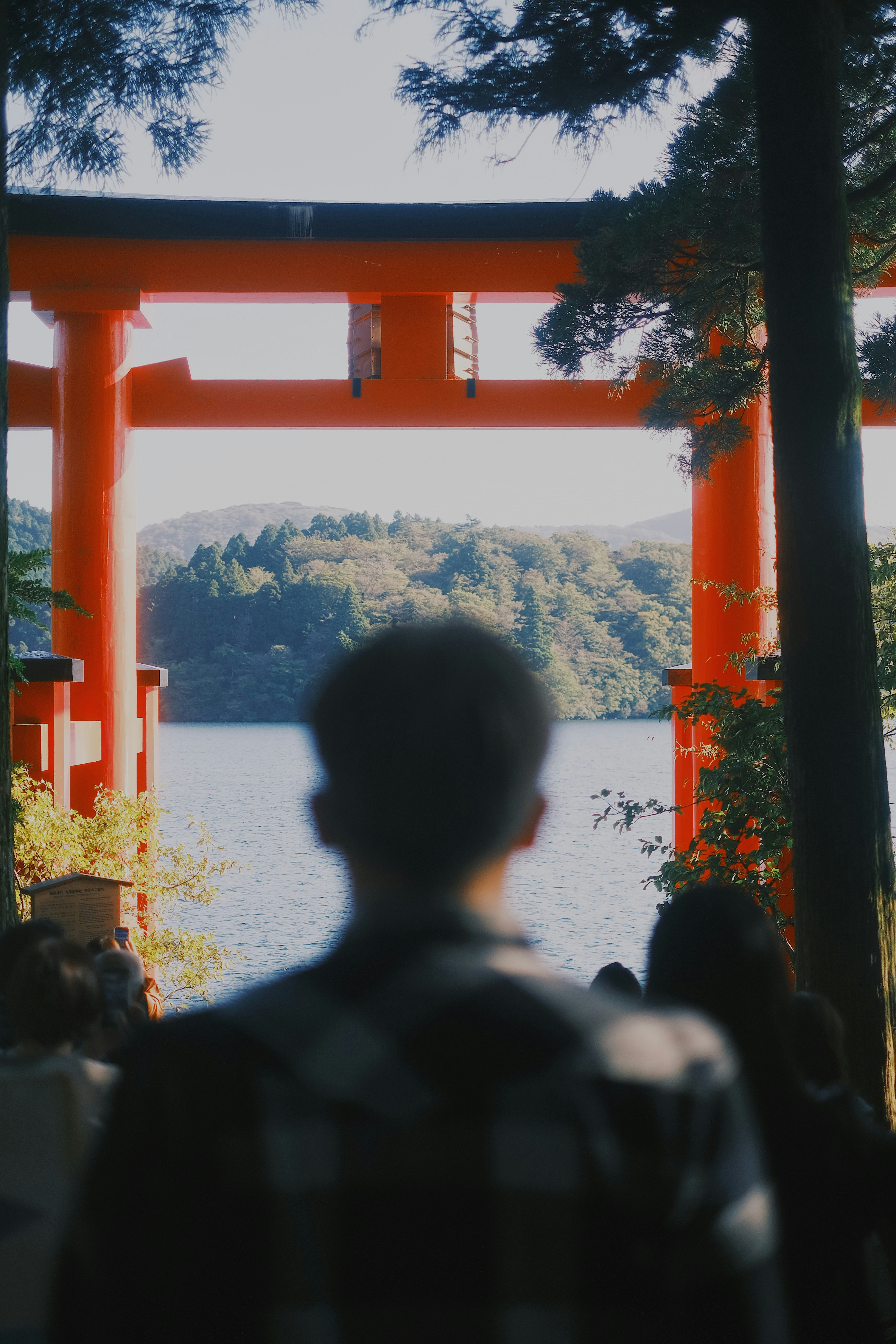 A man standing in front of a red tori tori tori tori tori tori tori ...