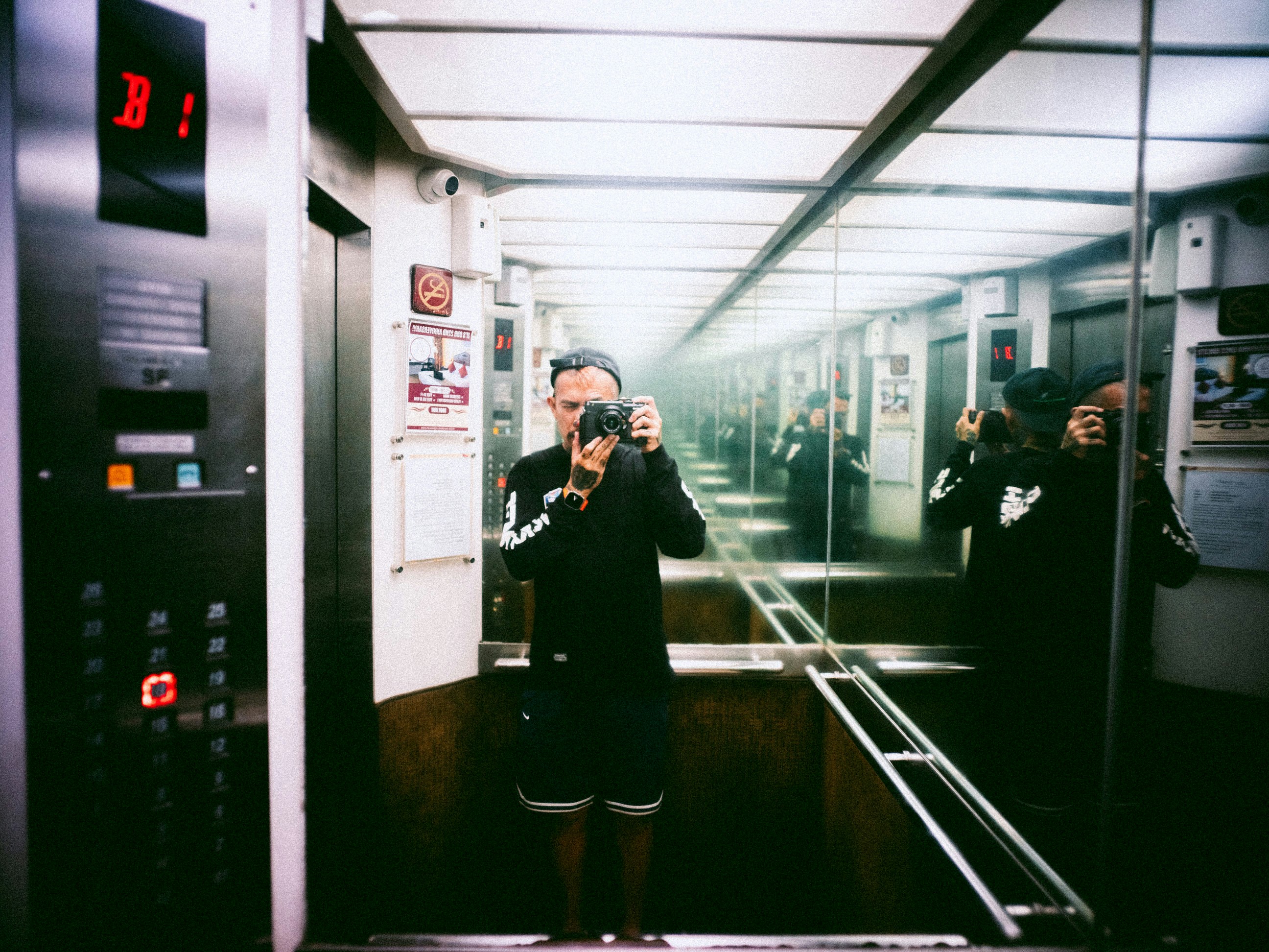 Glowing Elevator Echoes: Self-Portrait in a Shifting Hallway