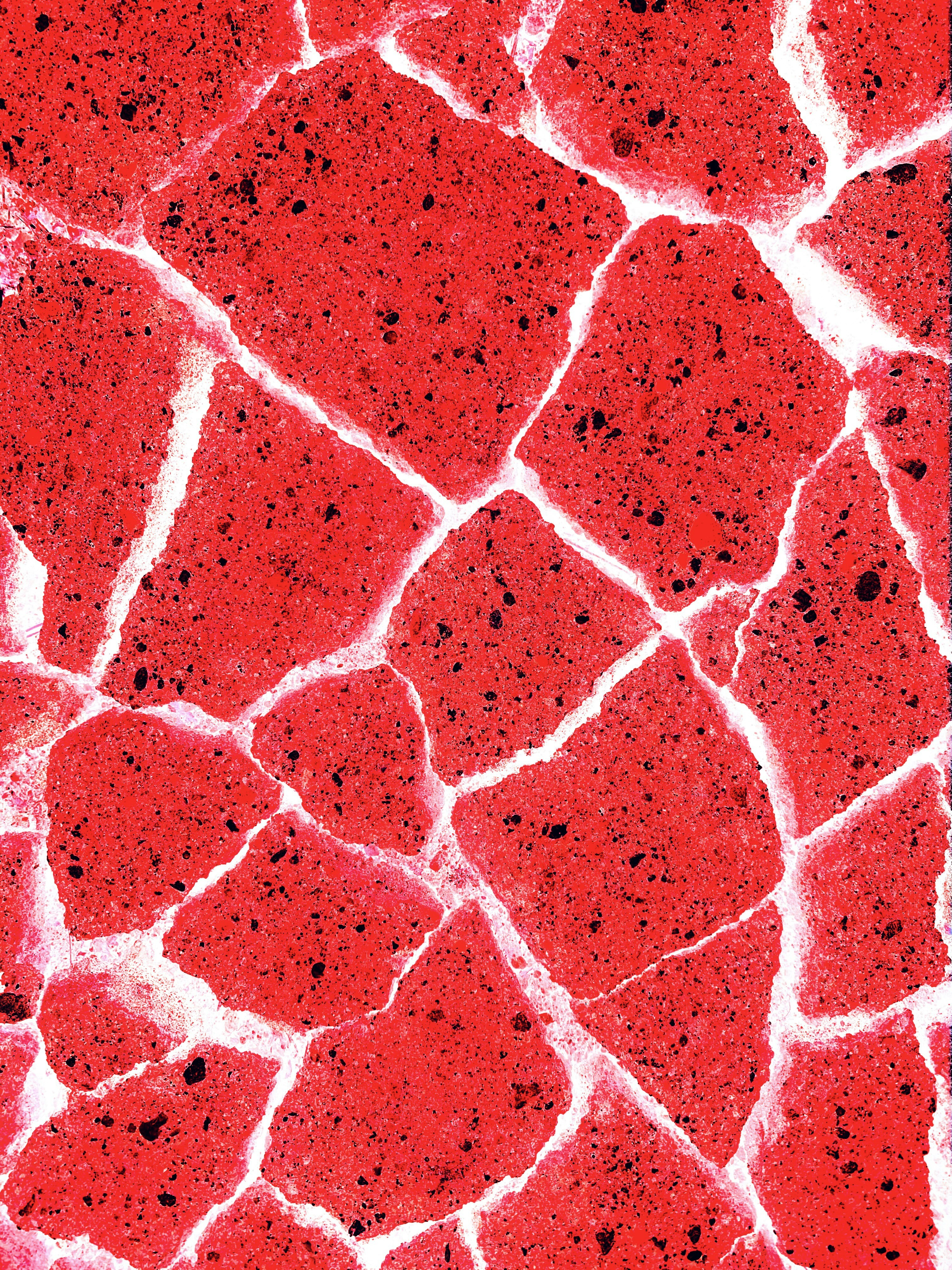 A close up of a red stone surface photo – Free Red color Image on Unsplash