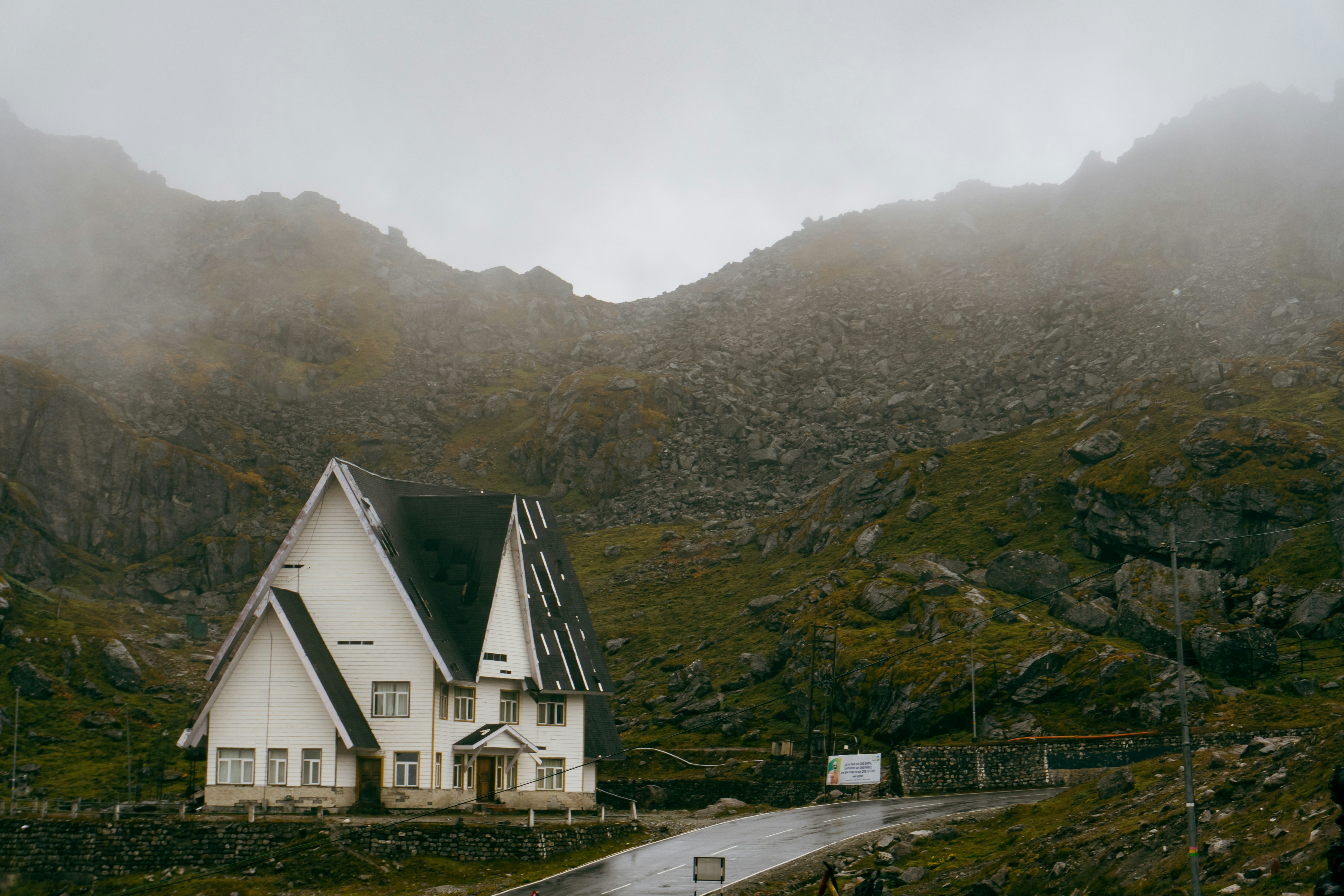 From the Alps of Switzerland. Right? This cute cabin building is situated at the India-China border — Nathula pass. The moment I saw this building covered with clouds, I knew that I had to capture it. When we were at the India-China border, our watches and mobile phones started began displaying China's time, which is 2 hours and 30 minutes ahead of Indian Standard Time (IST)