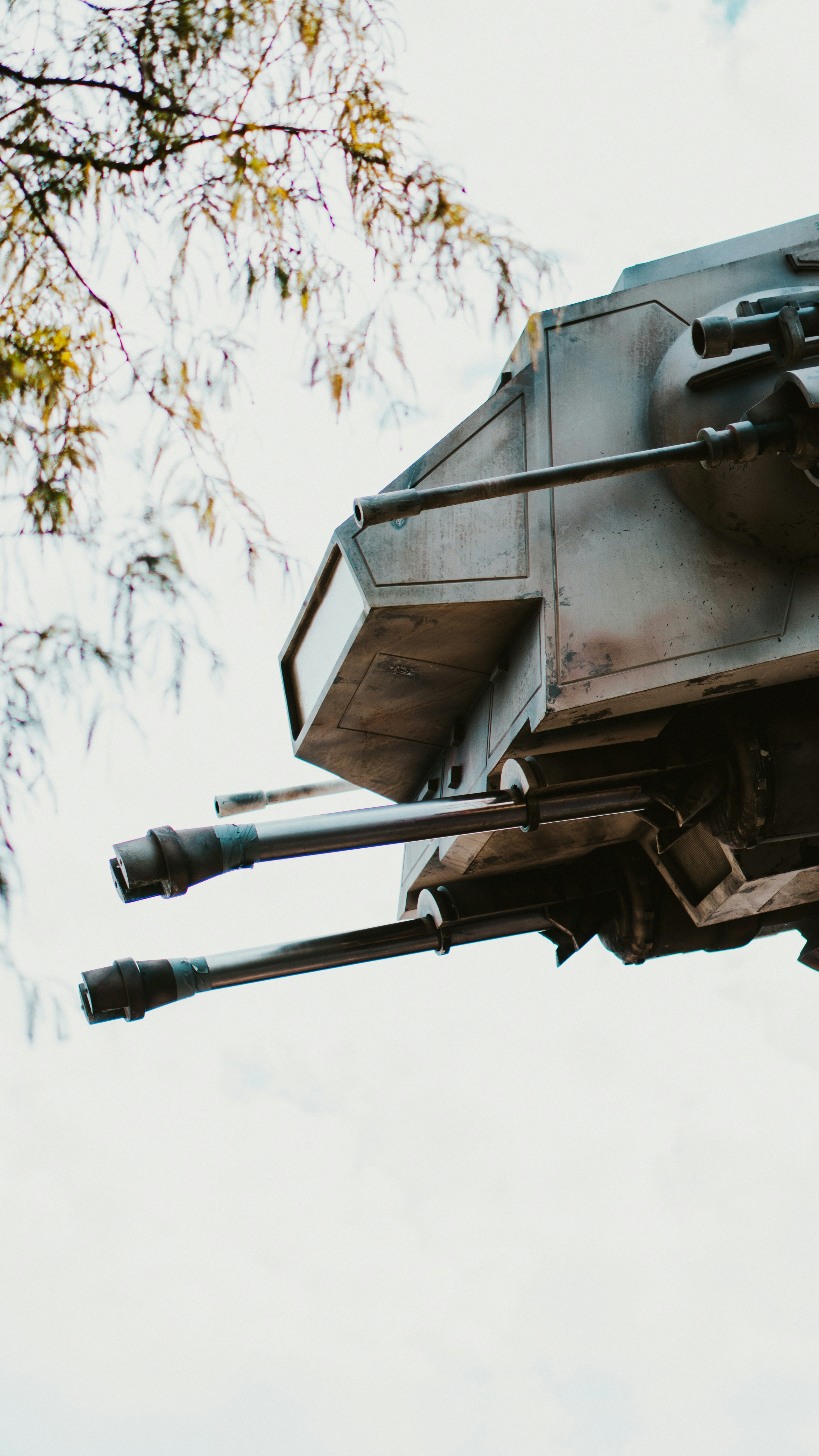 Triple-Barreled Turret Reaching Toward a Pale Sky