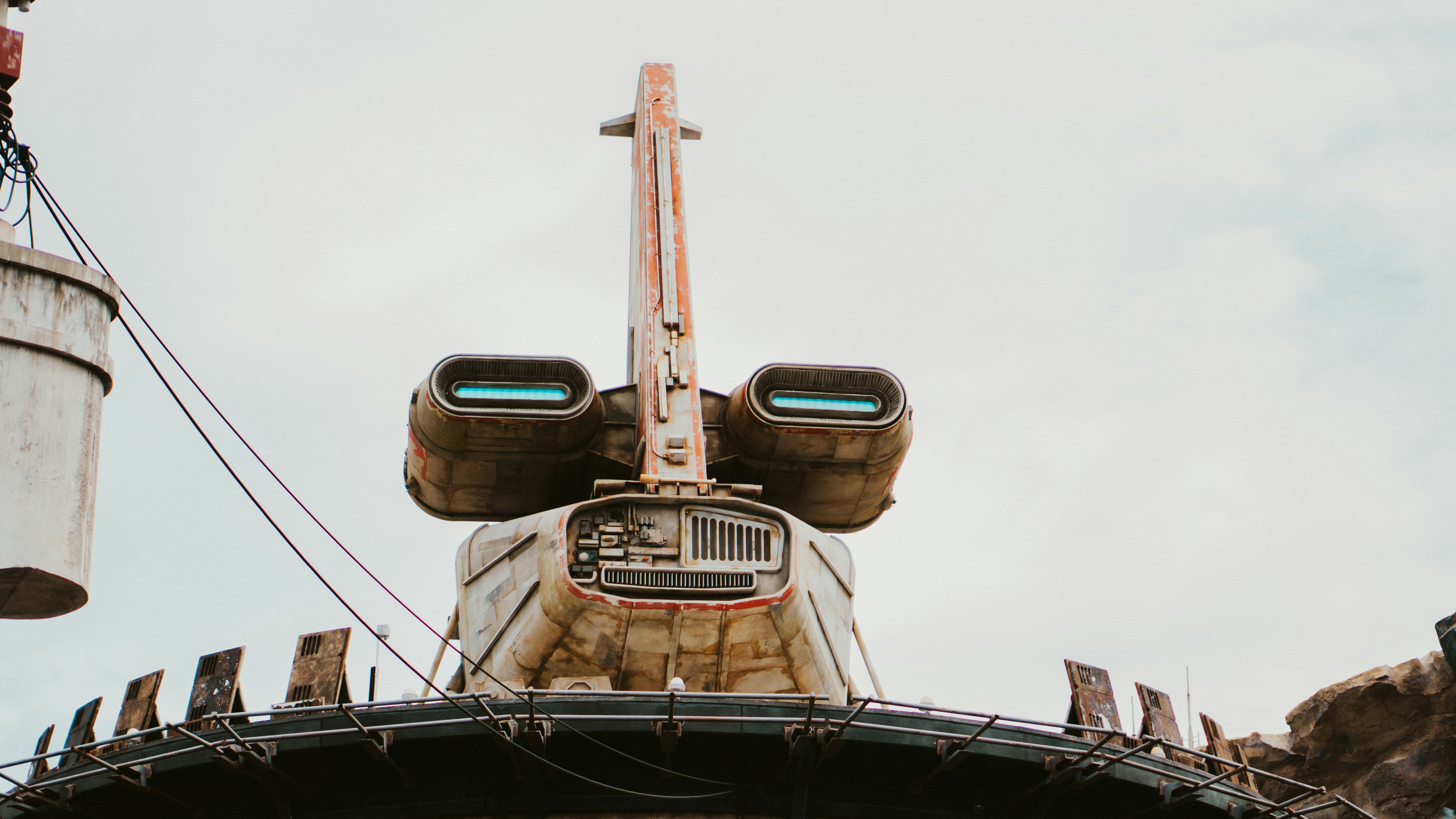 A close up of a crane on top of a building photo – Free Disney's ...