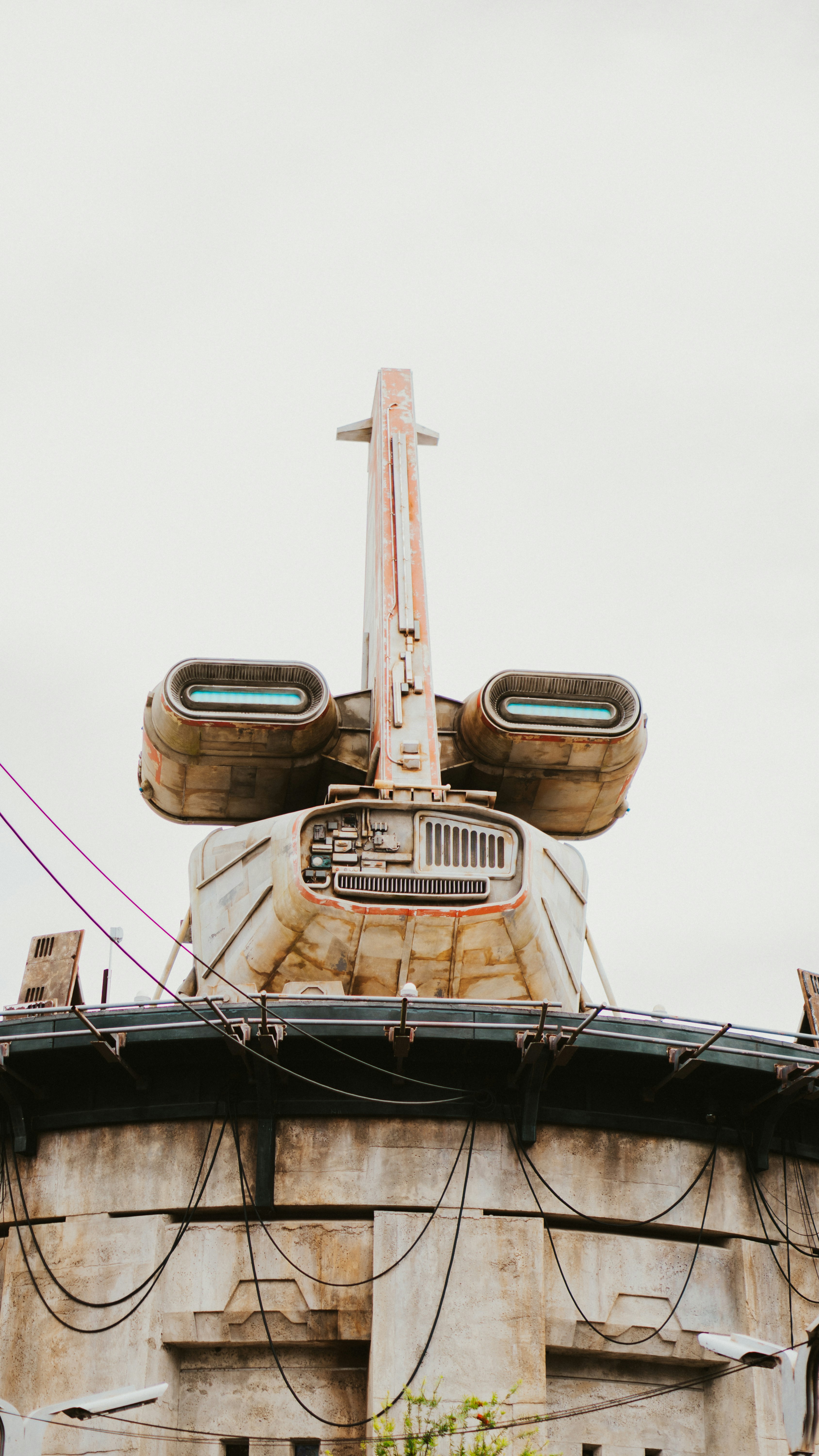 Rust Crown: A Retro-Futurist Vessel Pierces a Weathered Ring