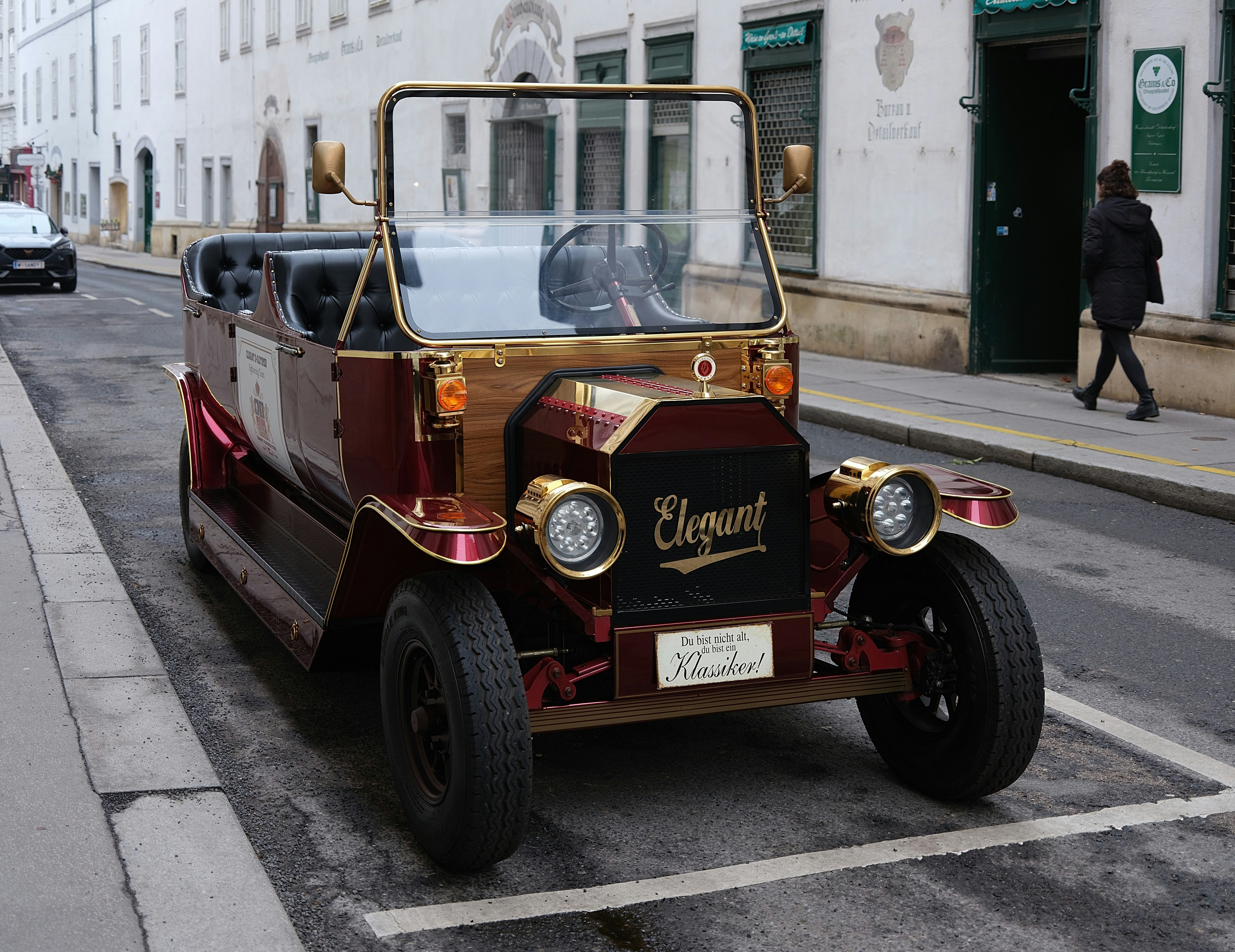 Ruby-Red Vintage Tourer Anchors a Quiet City Street