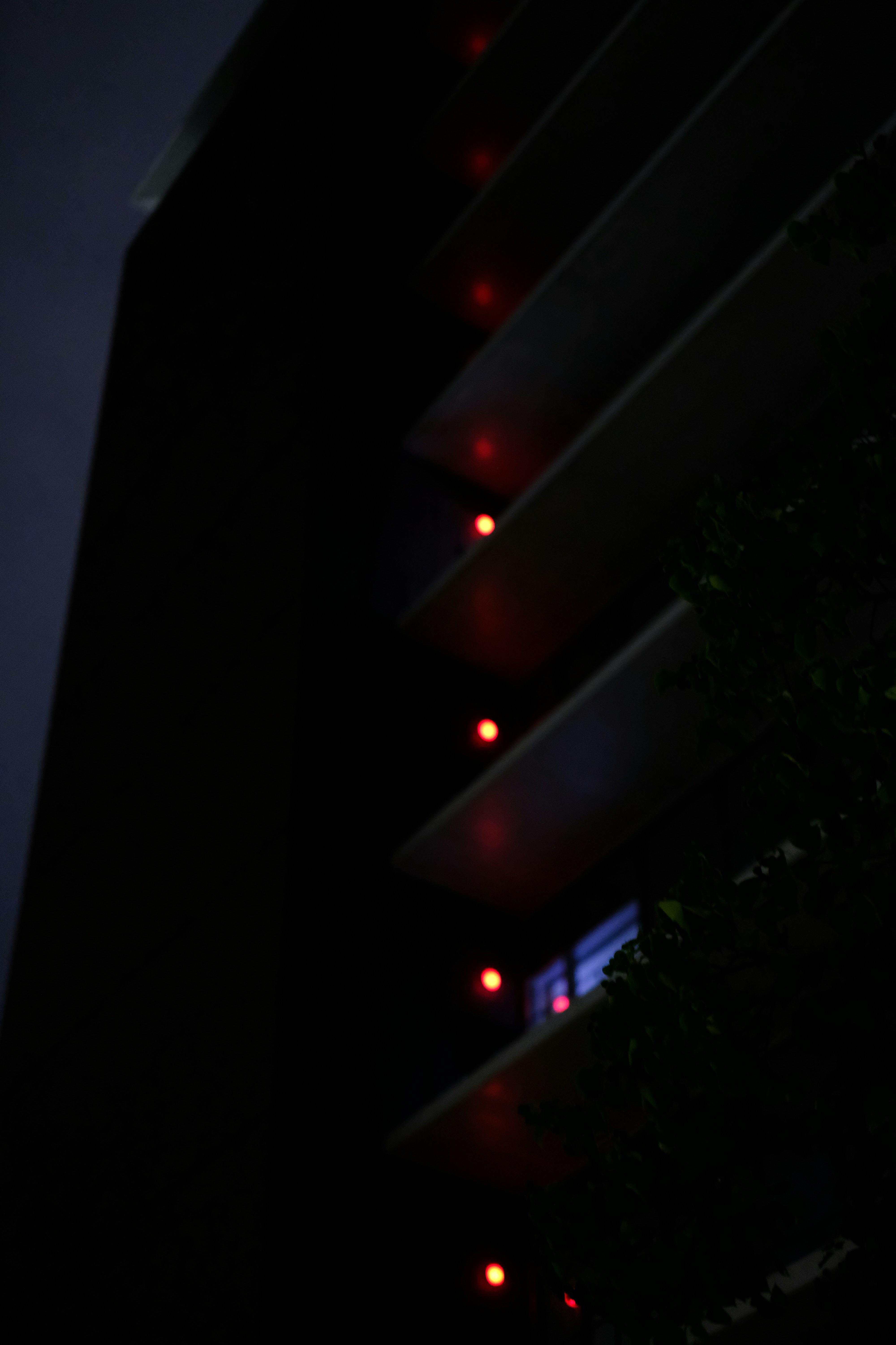 A building lit up with red lights at night photo – Free Japan Image on ...