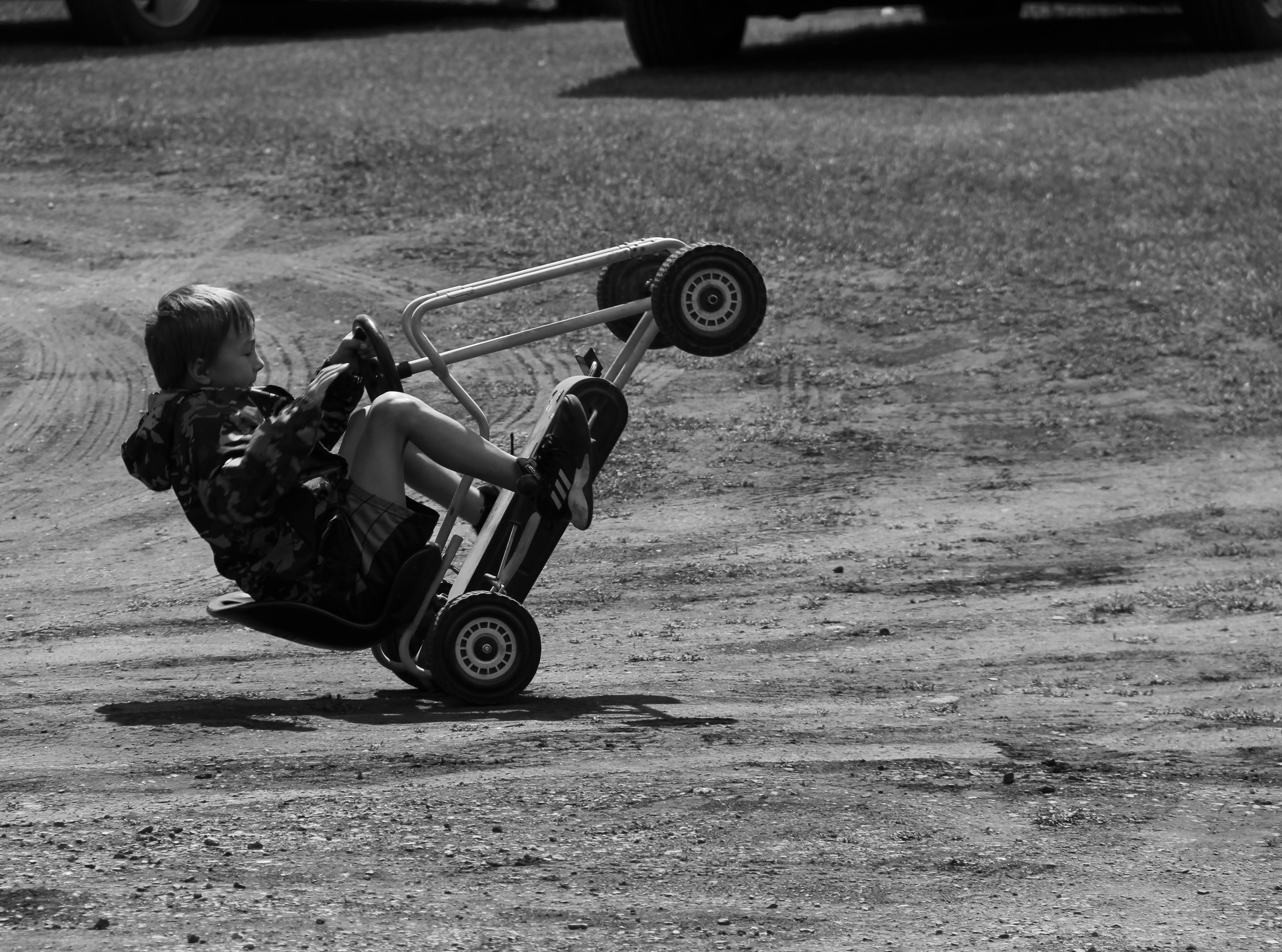Child on a Tilted Wheel: A Moment of Off-Balance Play