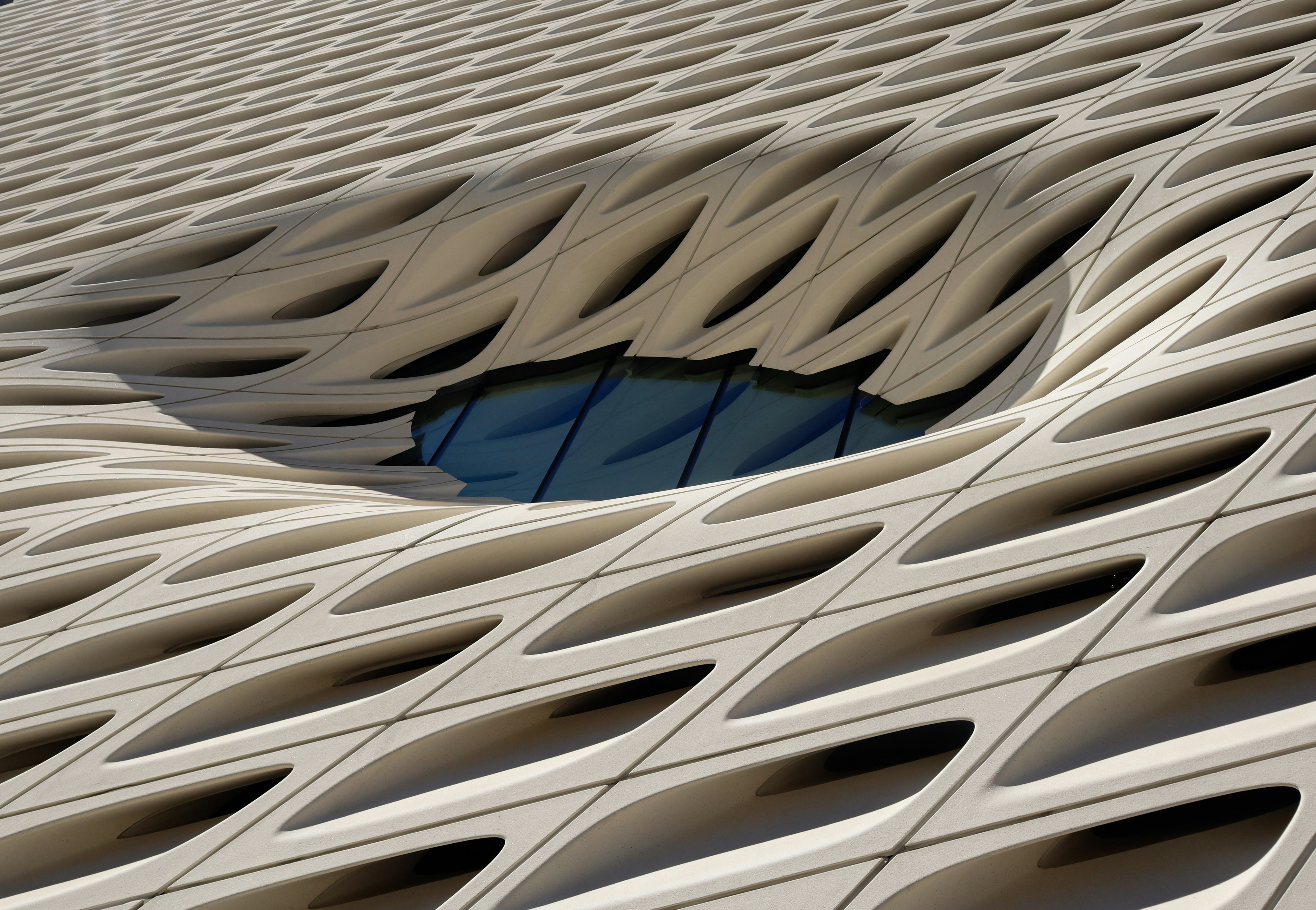 A building that has a hole in the middle of it photo – Free Hole Image ...