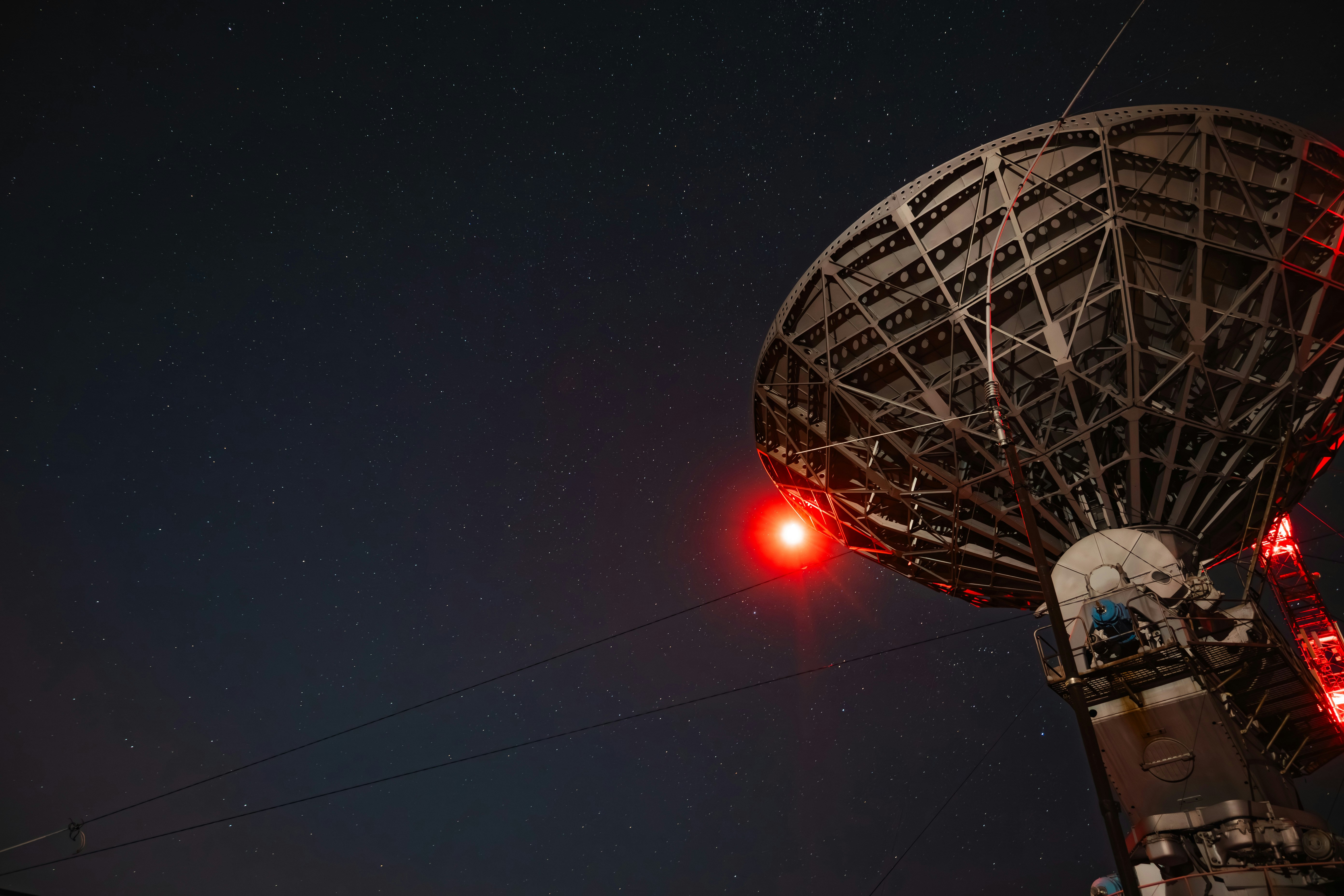 A radio tower with a red light on top of it photo – Free Antenna Image ...