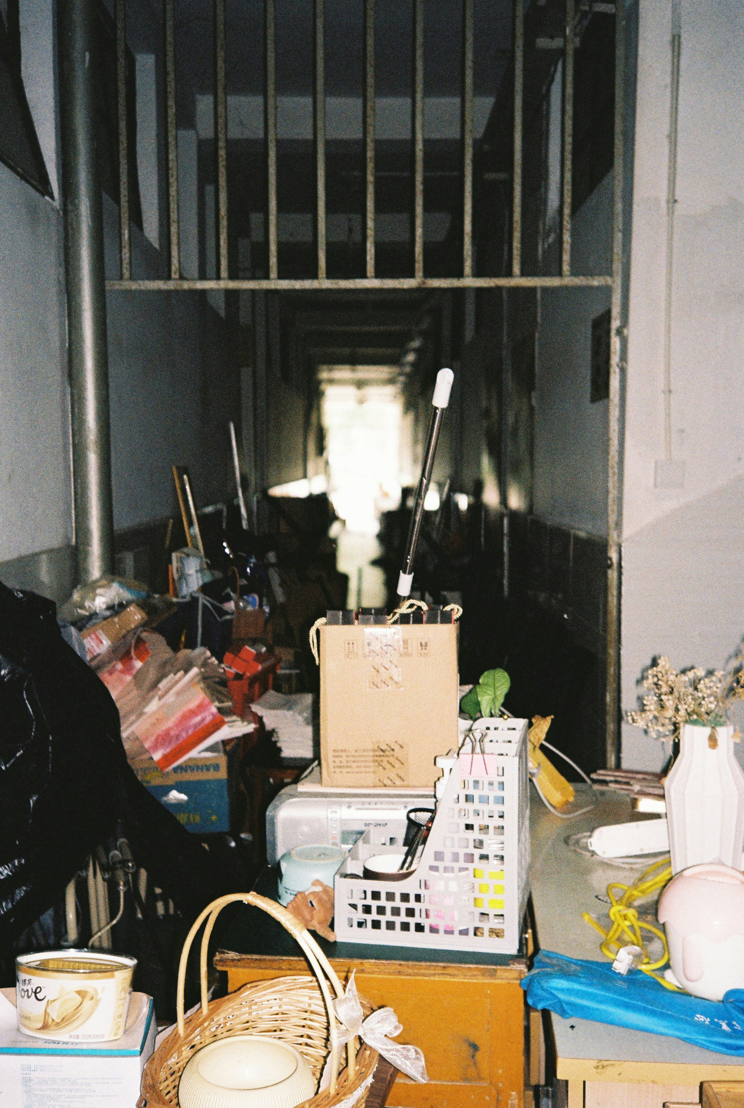 Beacon Beyond the Bins: Exit Light in a Cluttered Hallway