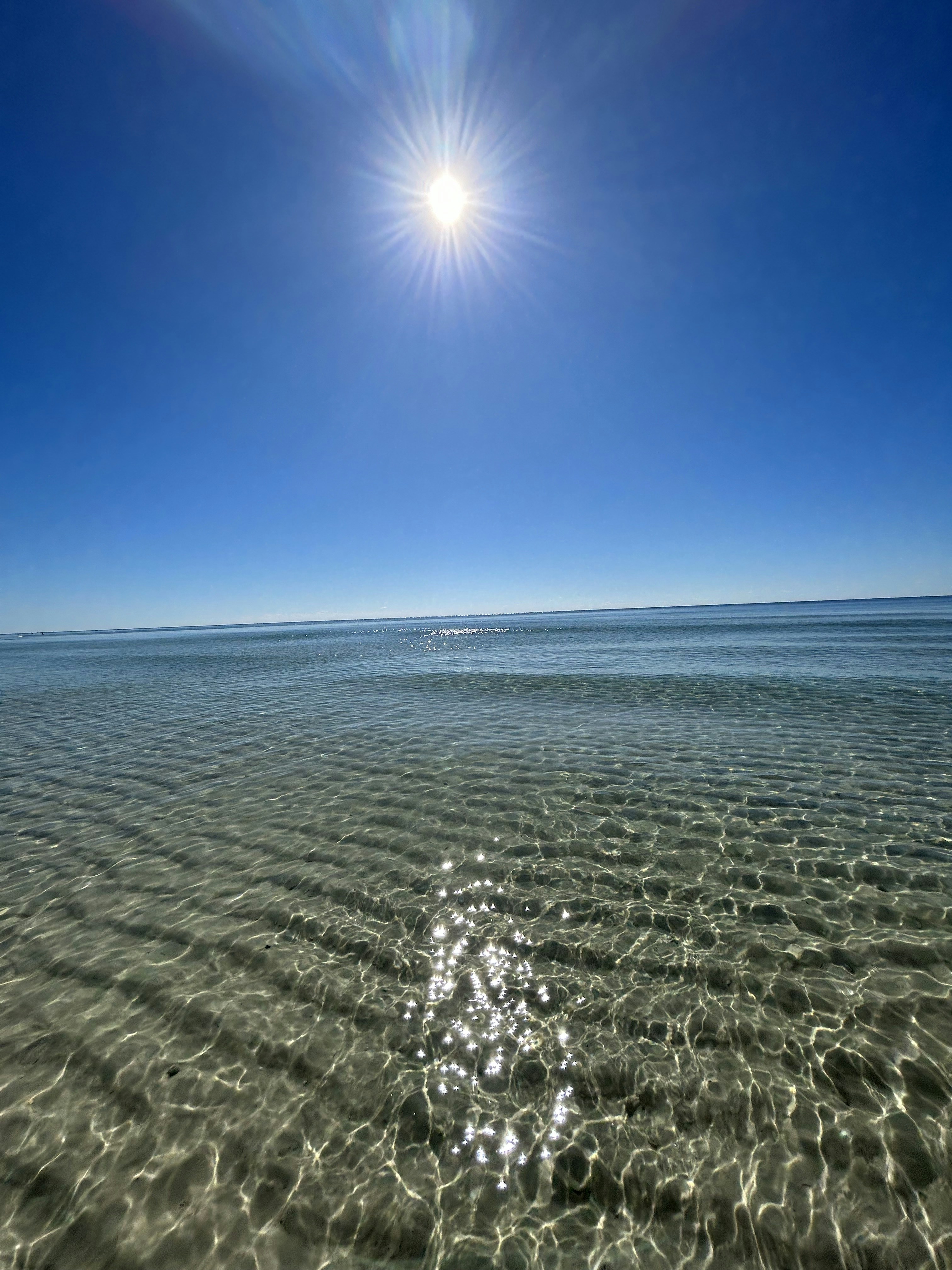 The sun is shining over the ocean water photo – Free Gulf shores Image ...