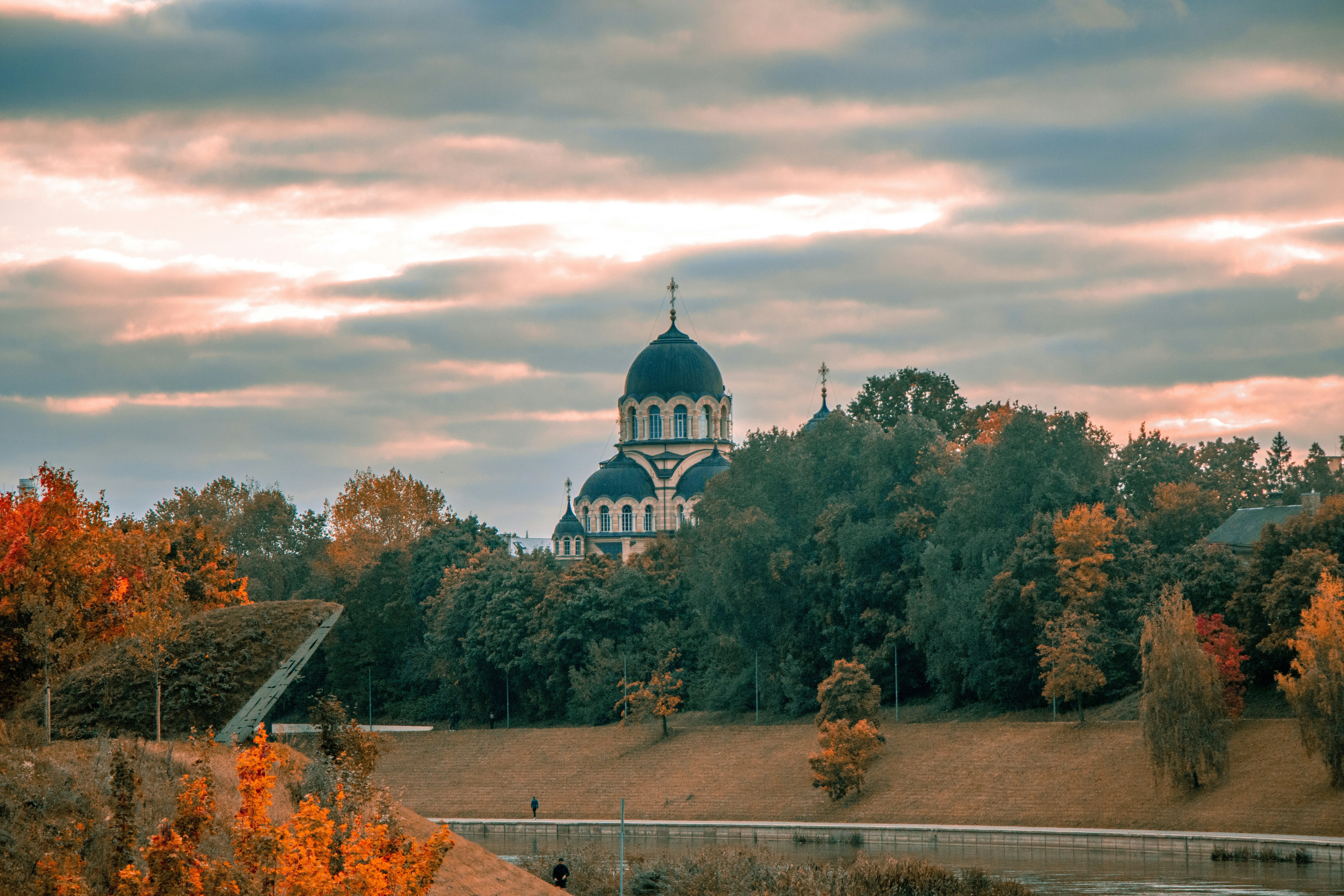 Onion Dome in Autumn Light: Cathedral Framed by a Tapestry of Fall Trees