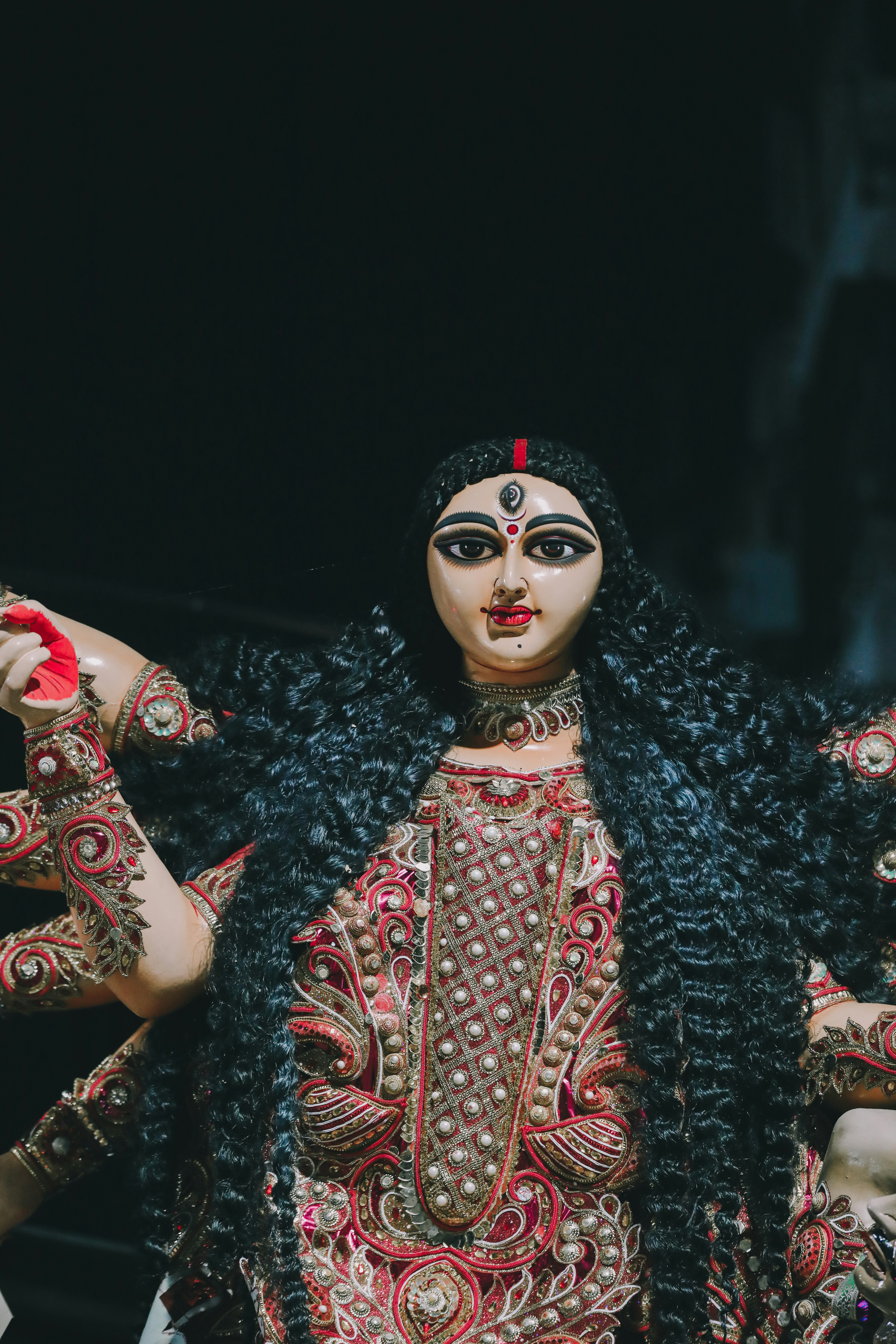 A statue of a woman with black hair and makeup photo – Free Durga devi ...