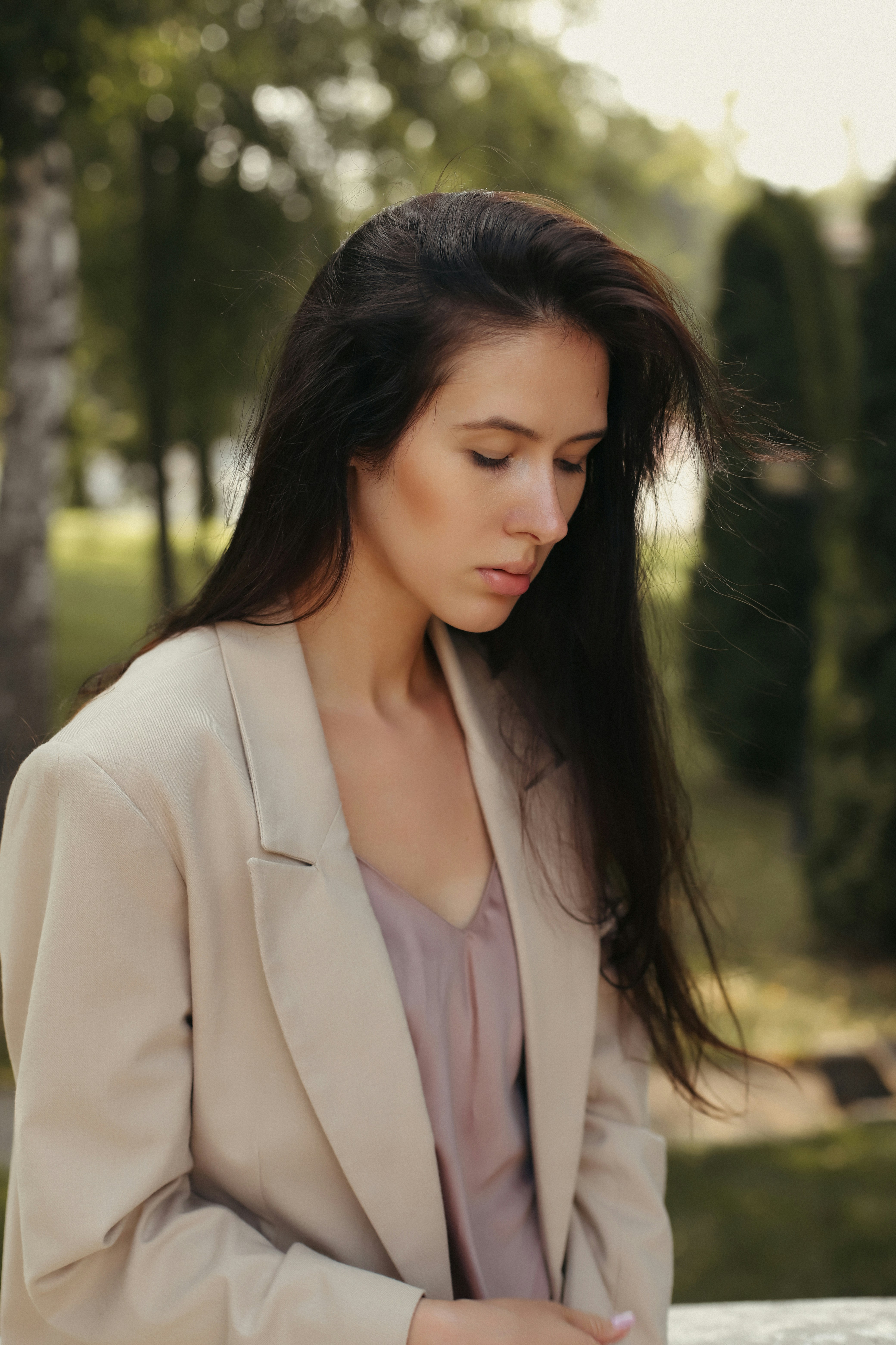 Dappled Light Portrait: Quiet Confidence in a Park Setting