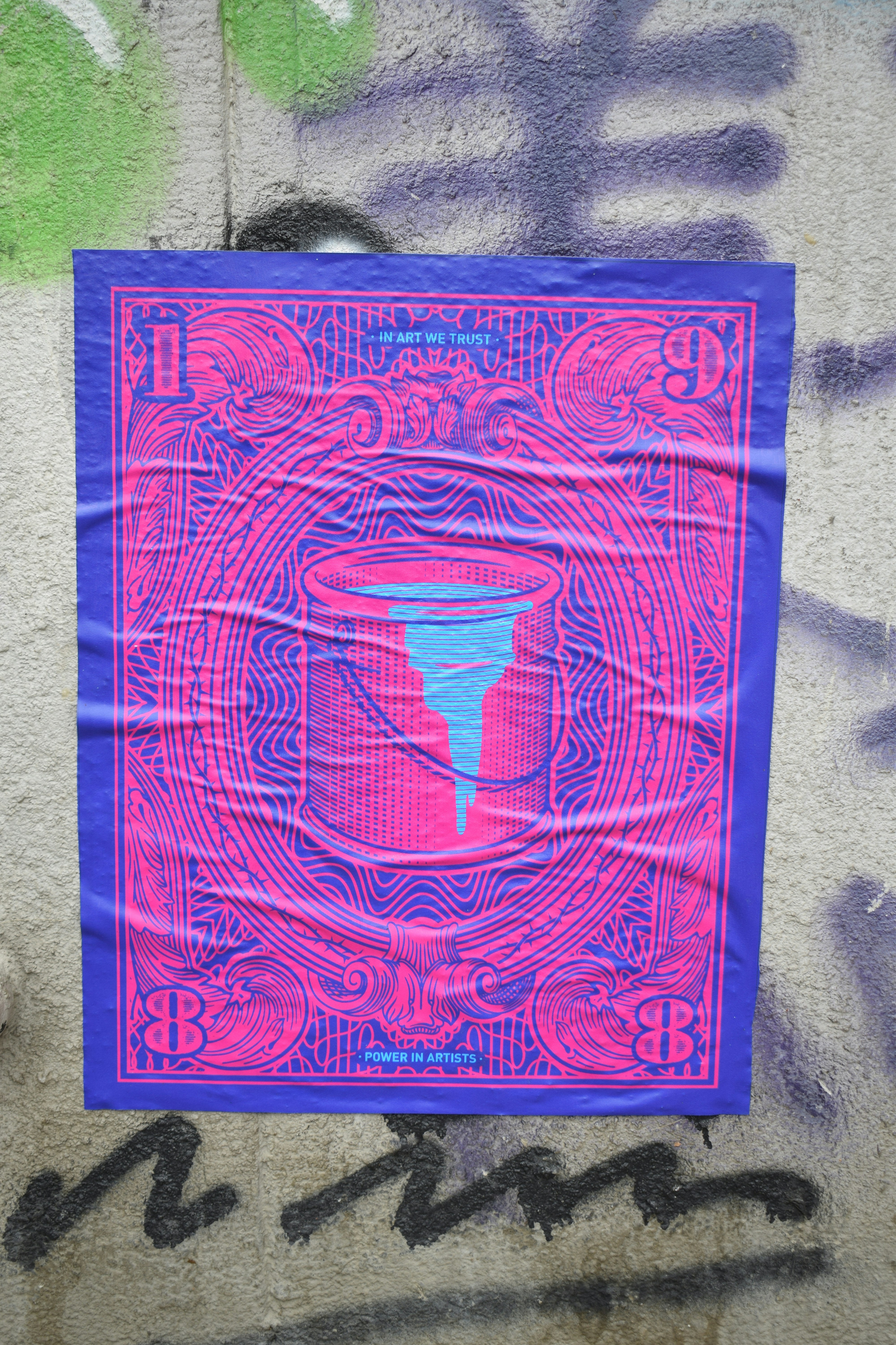 A blue and pink poster hanging on a wall photo – Free Purple Image on ...