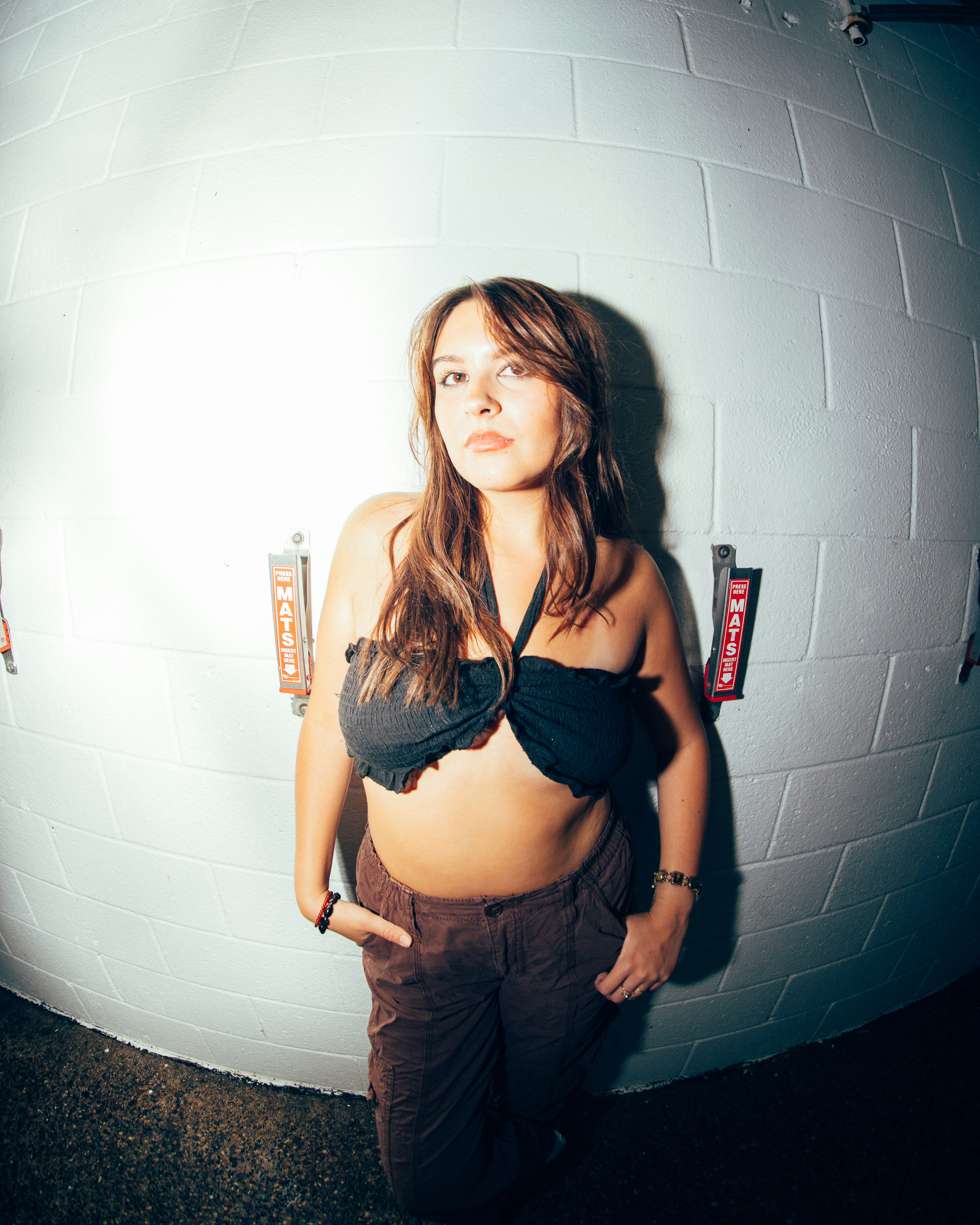 Curvature and Confidence: A Fisheye Portrait Against a White Wall